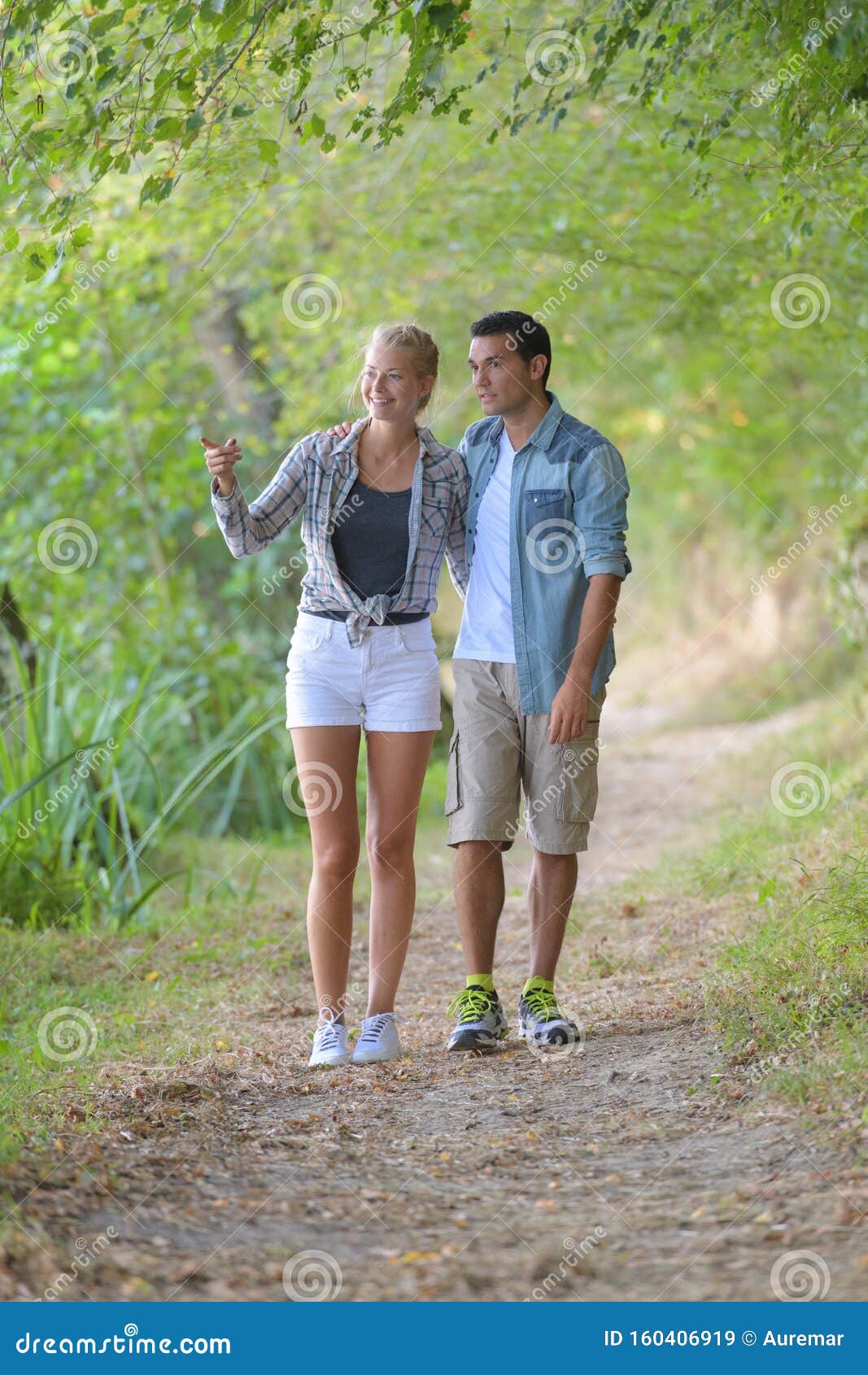 Couple Walking Along Country Path Stock Image - Image of landscape ...
