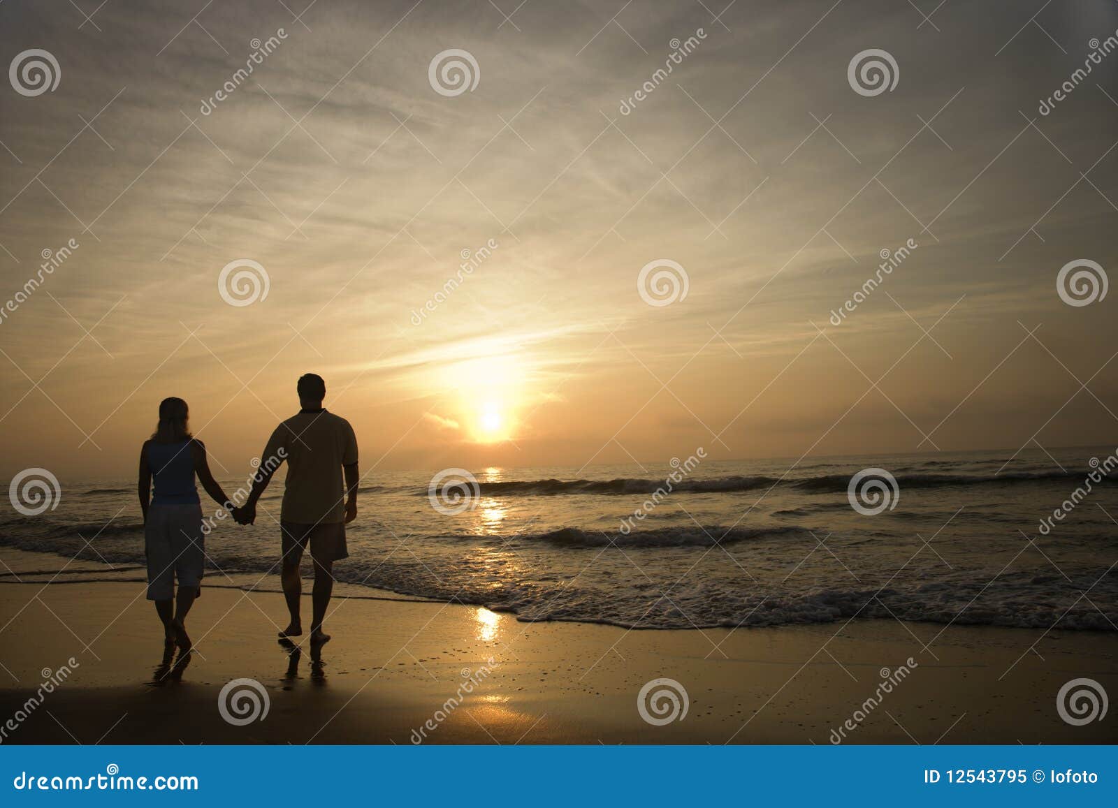 Couple Walking on Beach at Sunset Stock Image - Image of outdoors ...