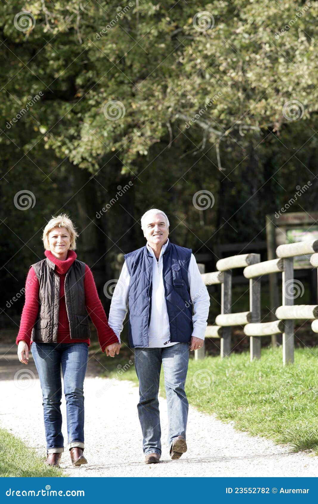 Couple walking down path stock photo. Image of park, path - 23552782