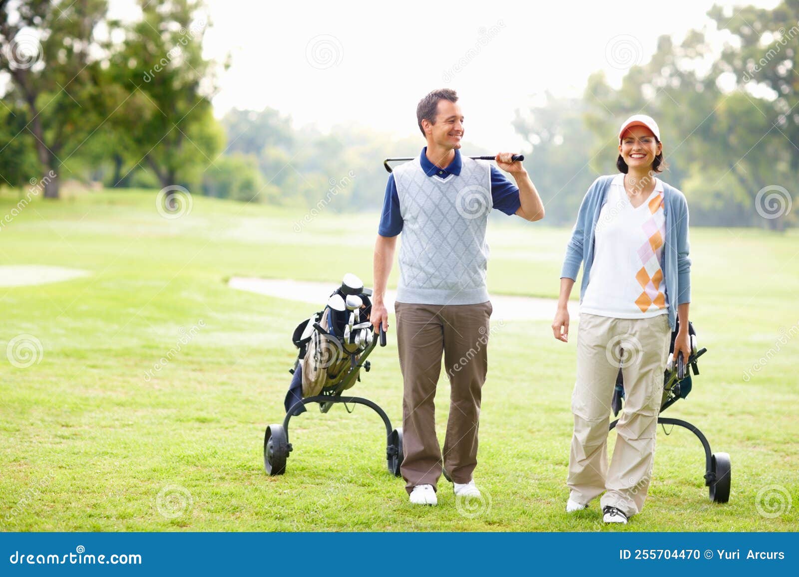 Couple Walking on Golf Course. Full Length of Couple Walking on Golf ...