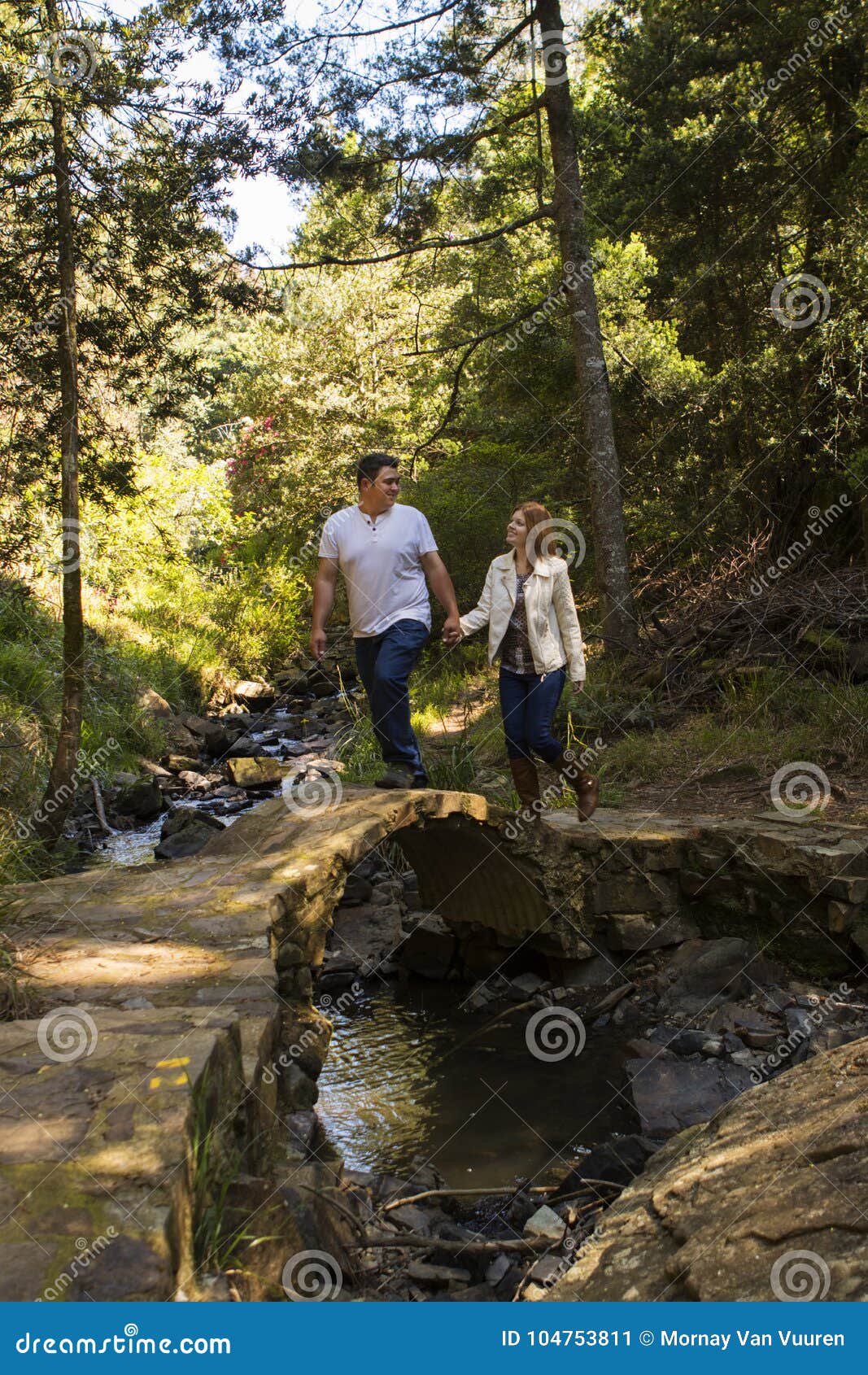 Couple Walking Over a Bridge Crossing a River Stock Image - Image of ...