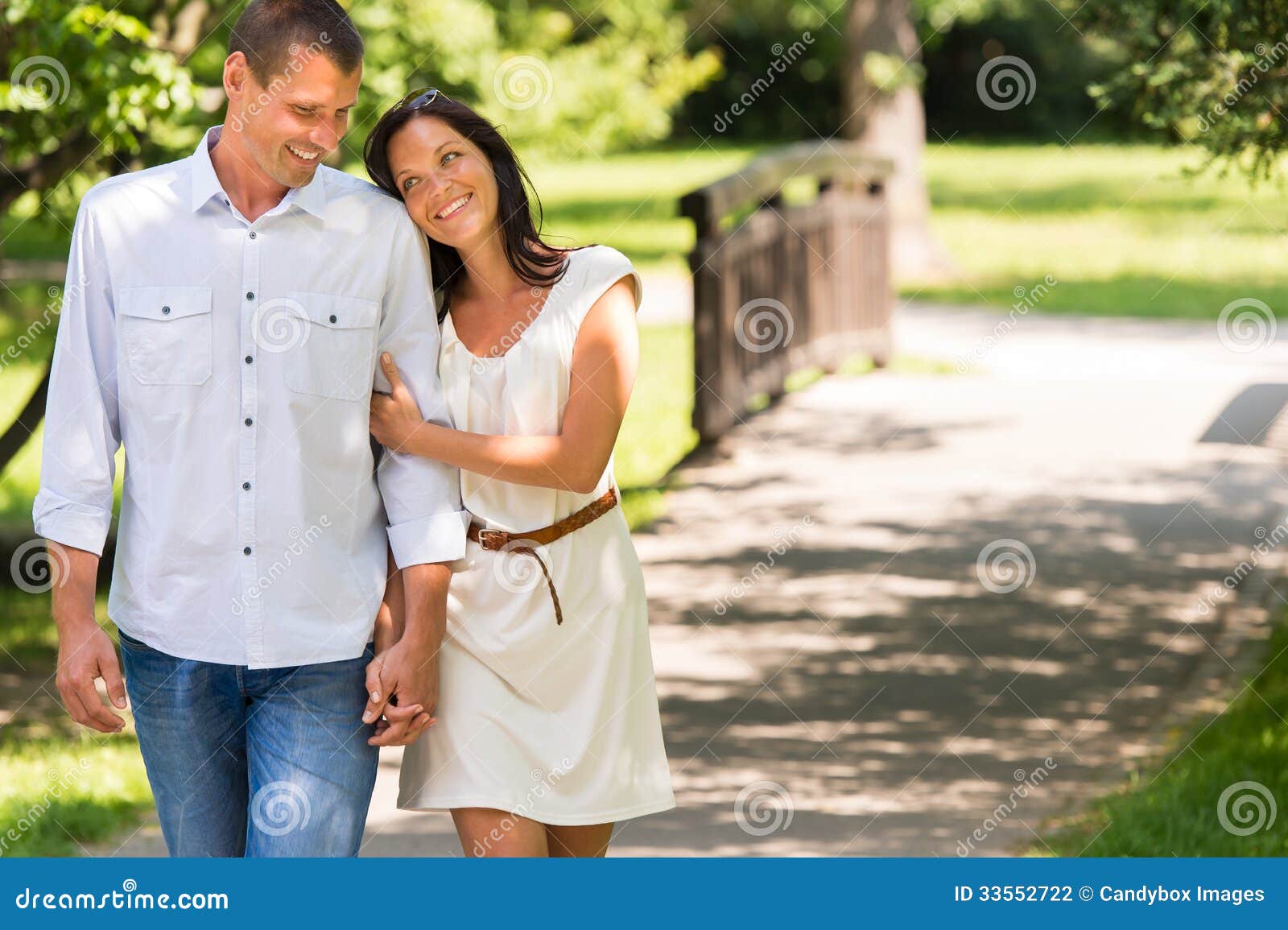 Couple Walking in Park Hand in Hand Stock Photo - Image of hand ...