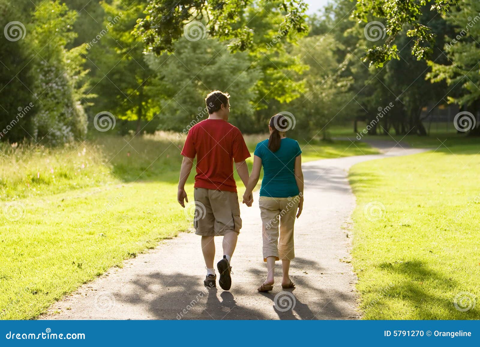 Couple Walking through Park-Horizontal Stock Photo - Image of affection ...