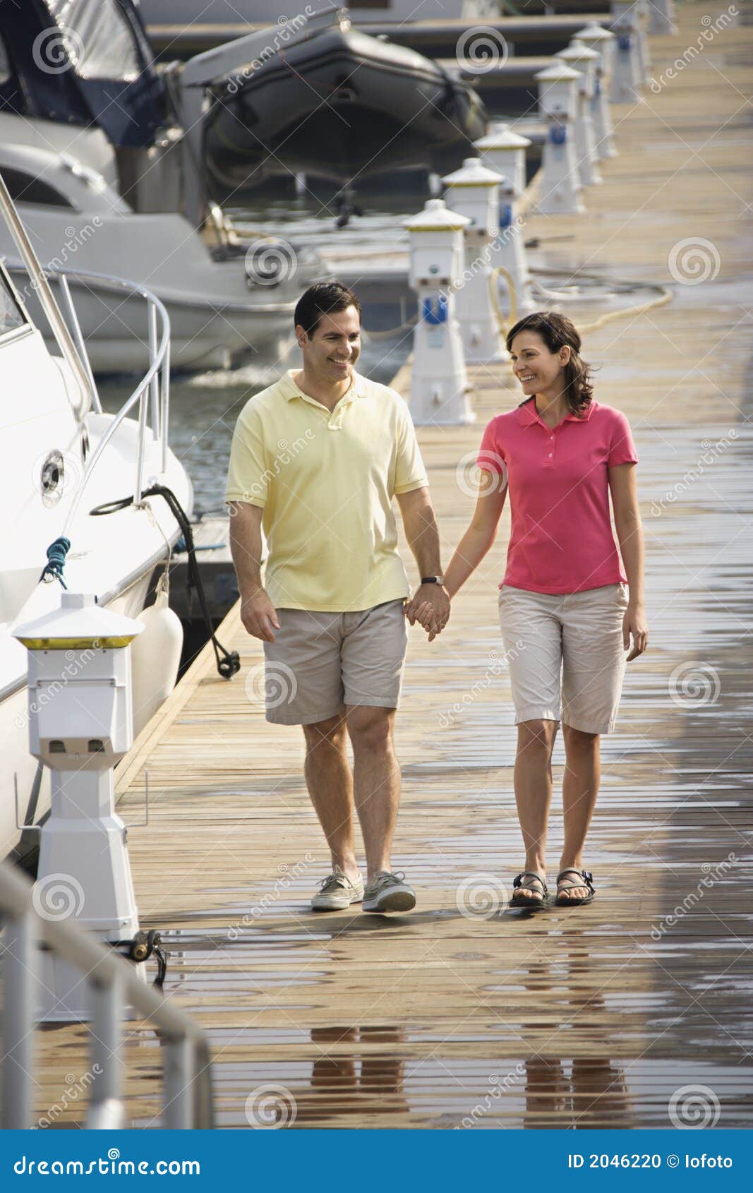 Couple walking together. stock photo. Image of boardwalk - 2046220
