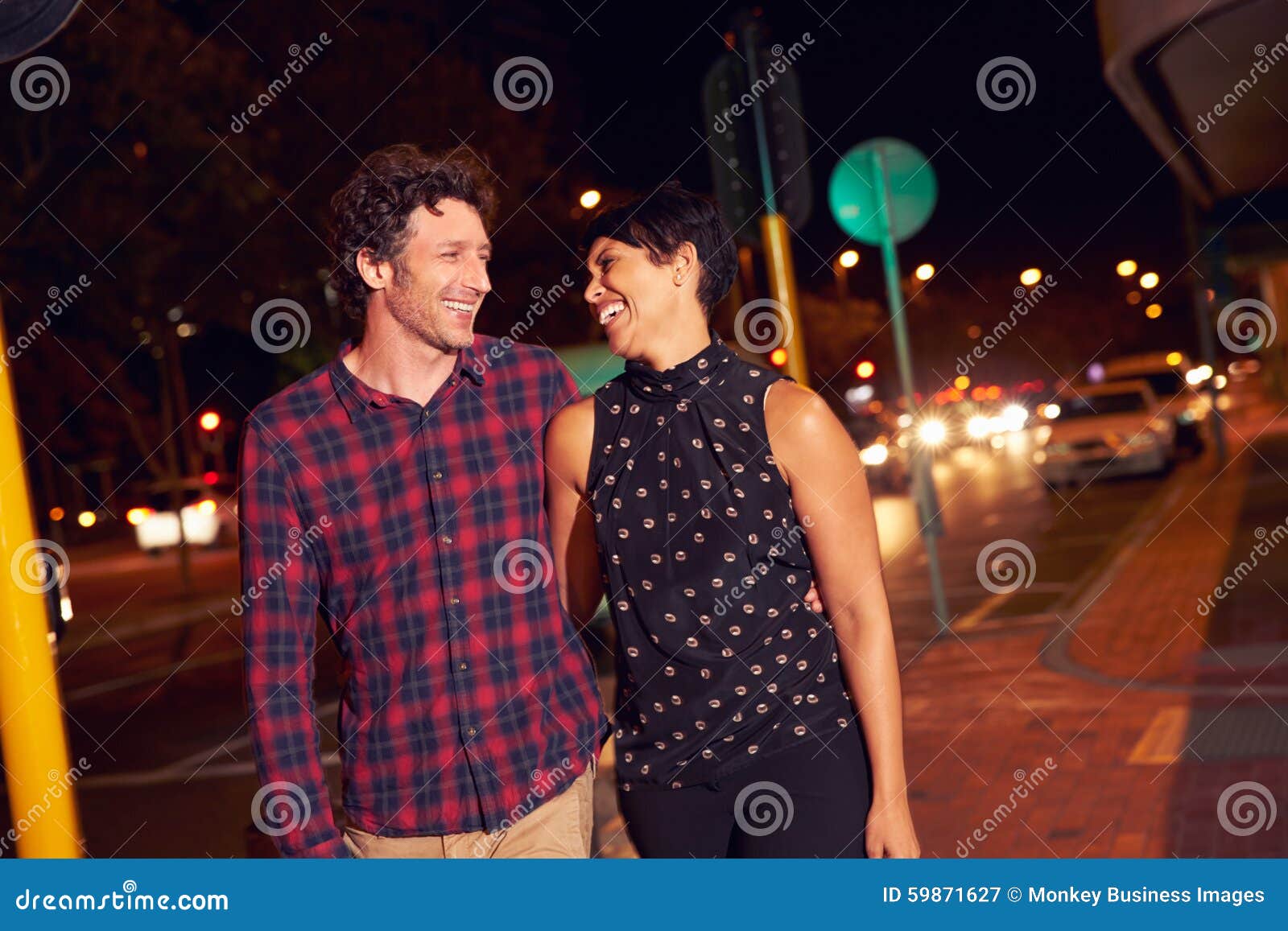 Couple Walking through Town Together at Night Stock Image - Image of ...