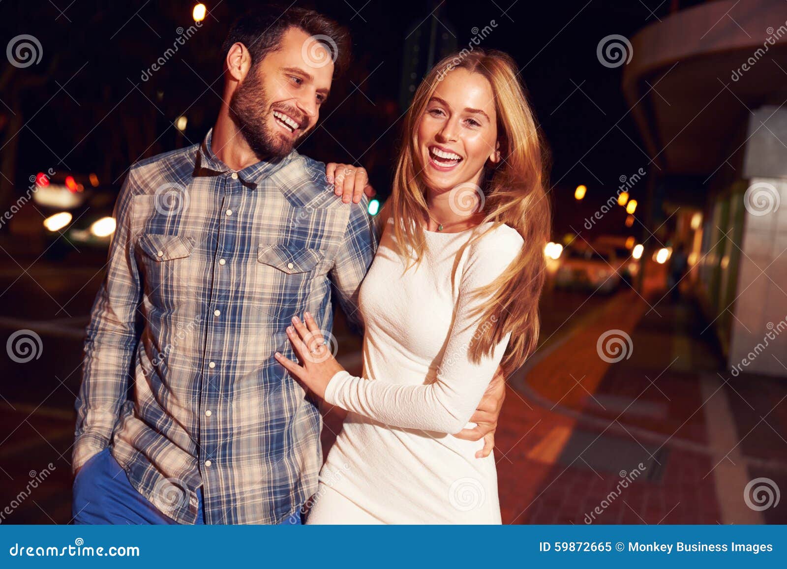 Couple Walking through Town Together at Night Stock Image - Image of ...
