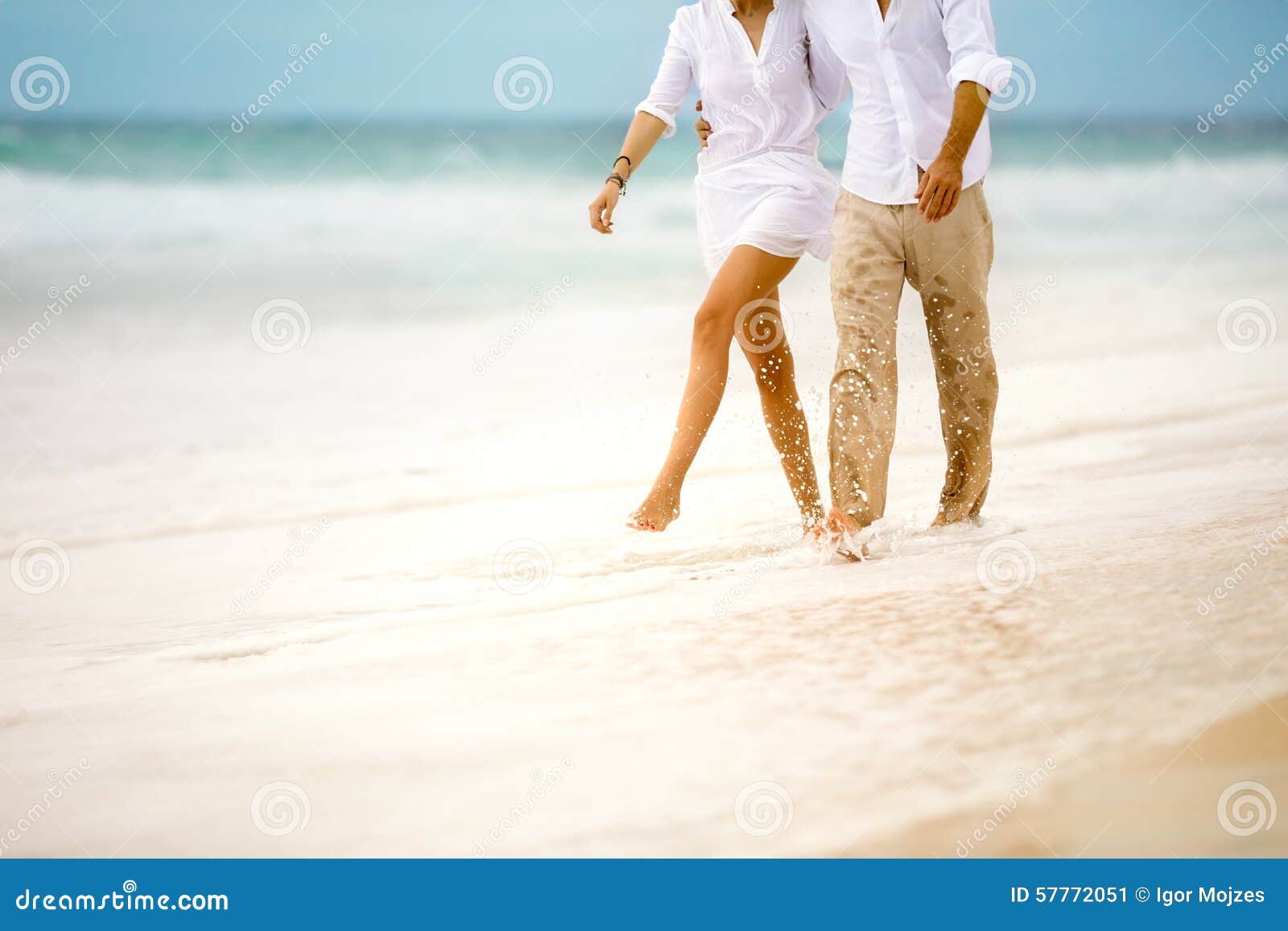 Couple Walking through the Waves Stock Image - Image of beautiful ...