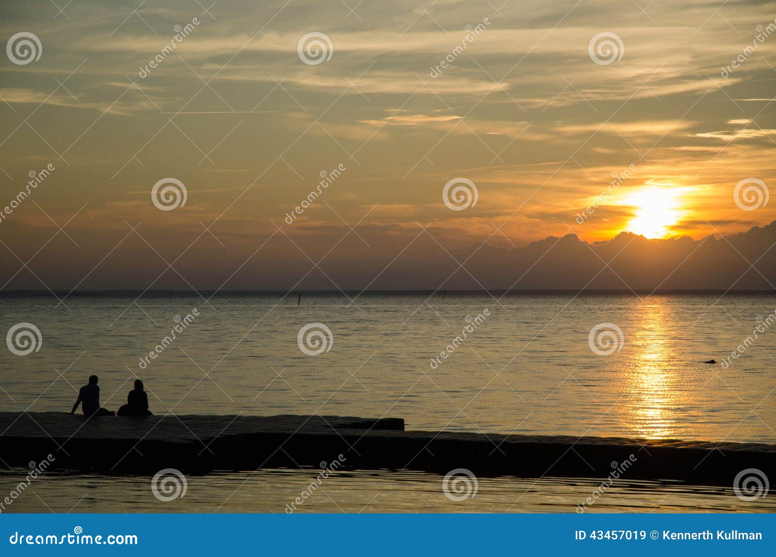 Couple Watching Sunset at a Pier Stock Image - Image of relaxed ...