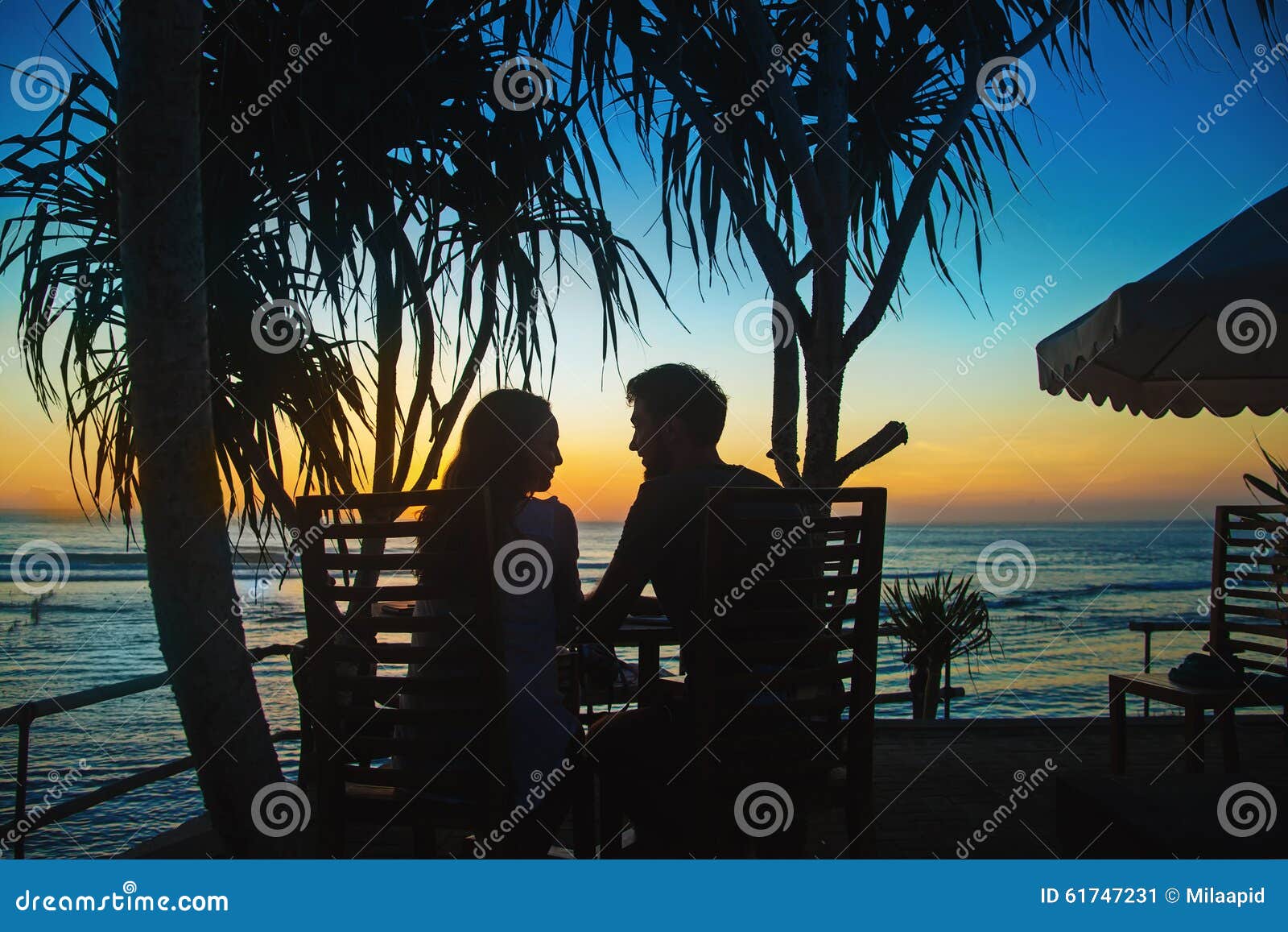 Couple watching sunset stock image. Image of exotic, people - 61747231