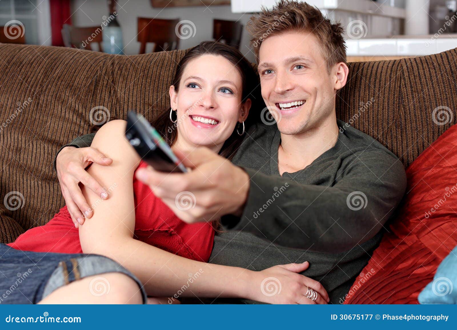 Couples Playing Video Games And Cuddling