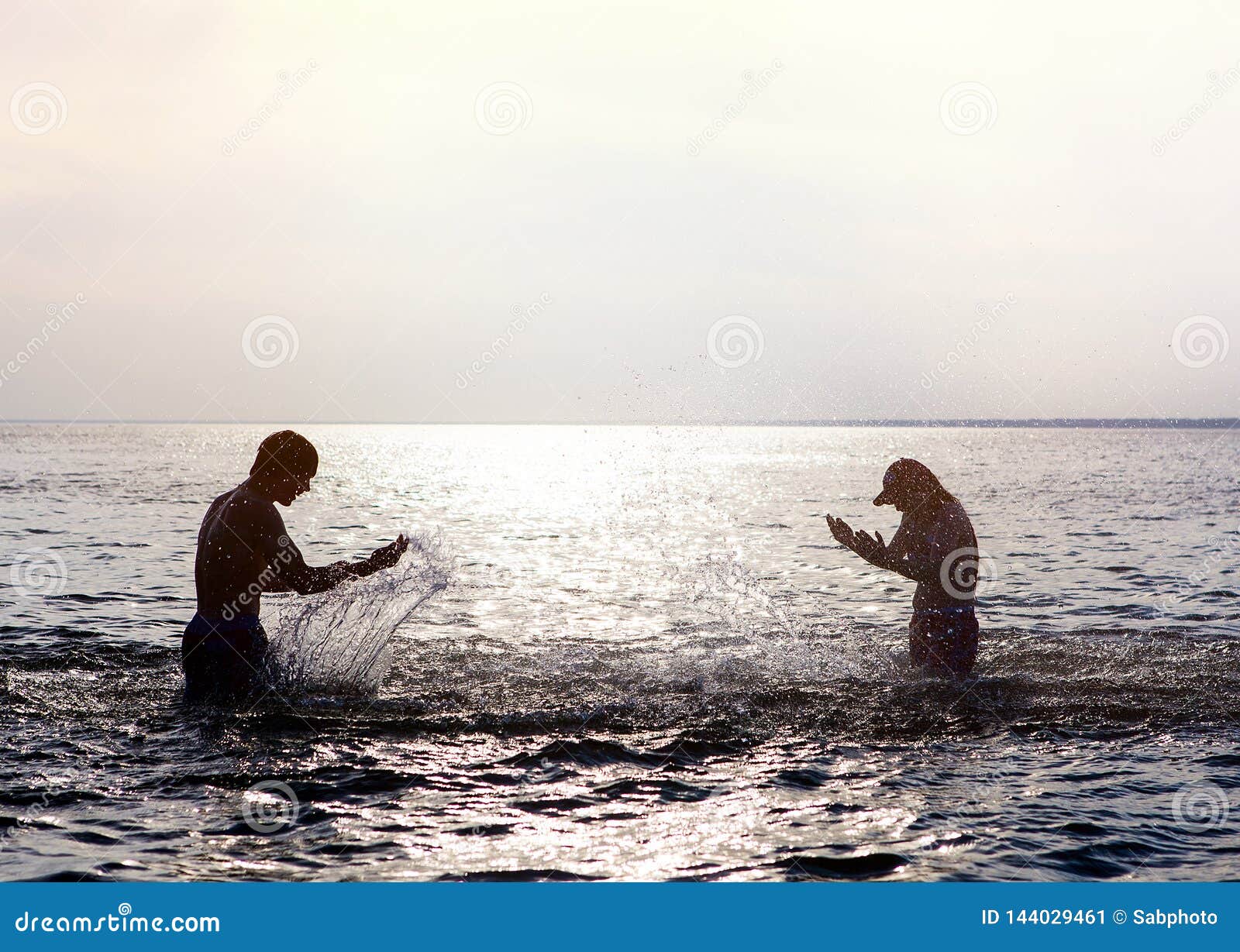 Couple in the Water stock image. Image of human, pour - 144029461