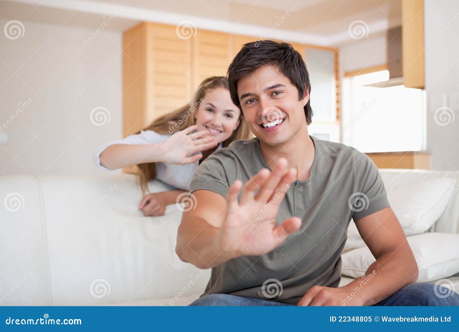 Couple Waving at the Camera Stock Image - Image of interior, happy ...