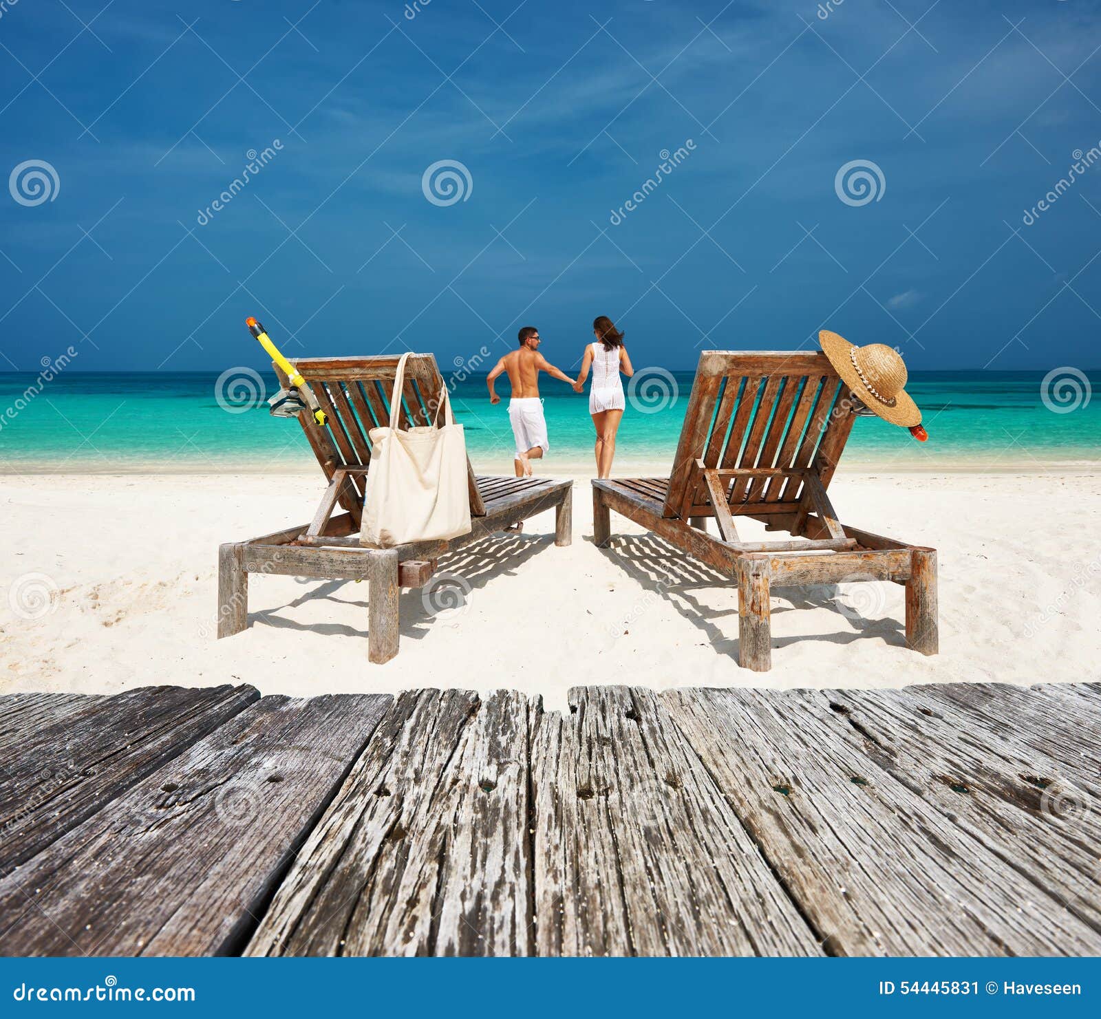Couple in White Relax on a Beach at Maldives Stock Image - Image of ...