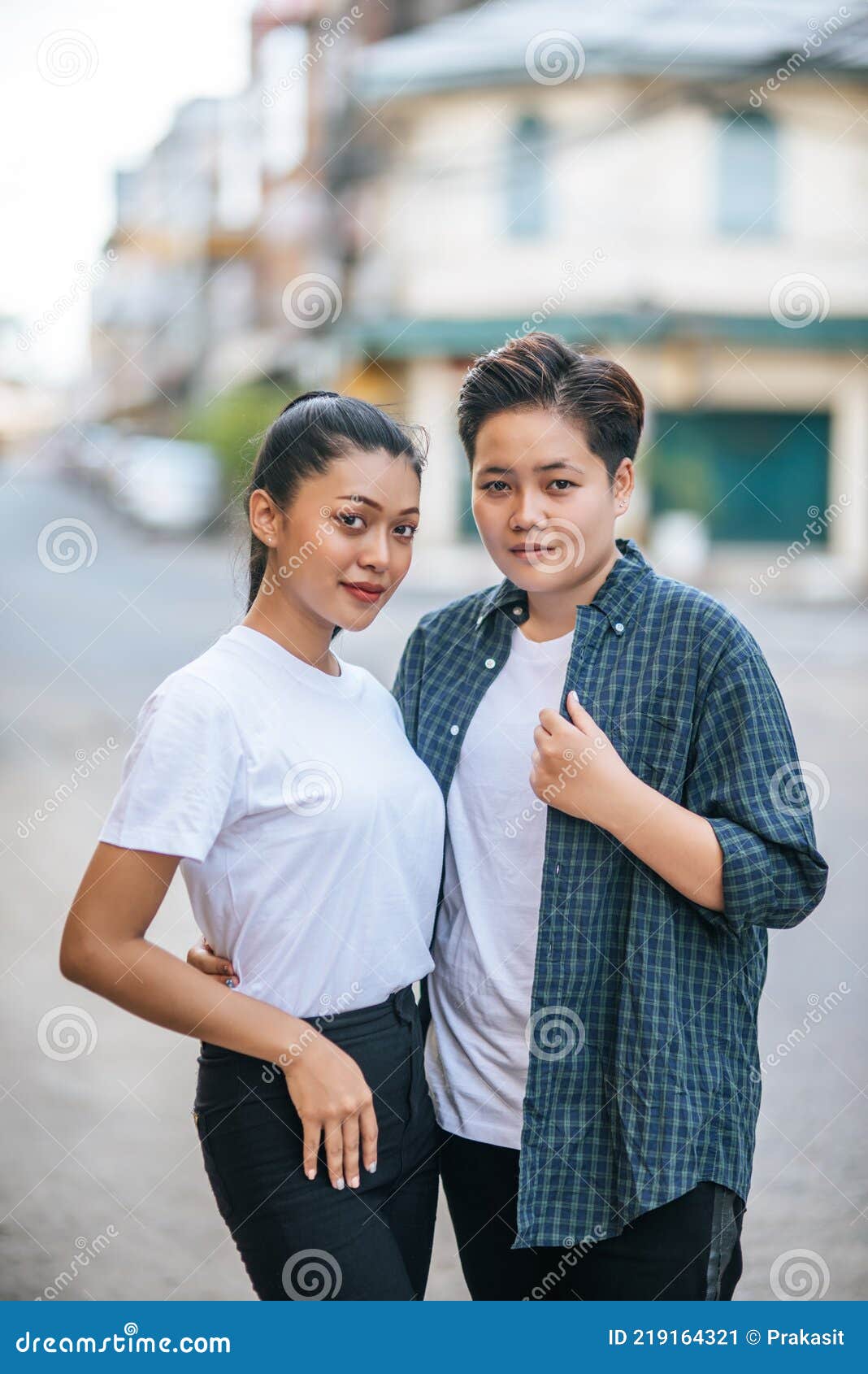 A Couple of Women Standing and Looking Forward Stock Image - Image of ...