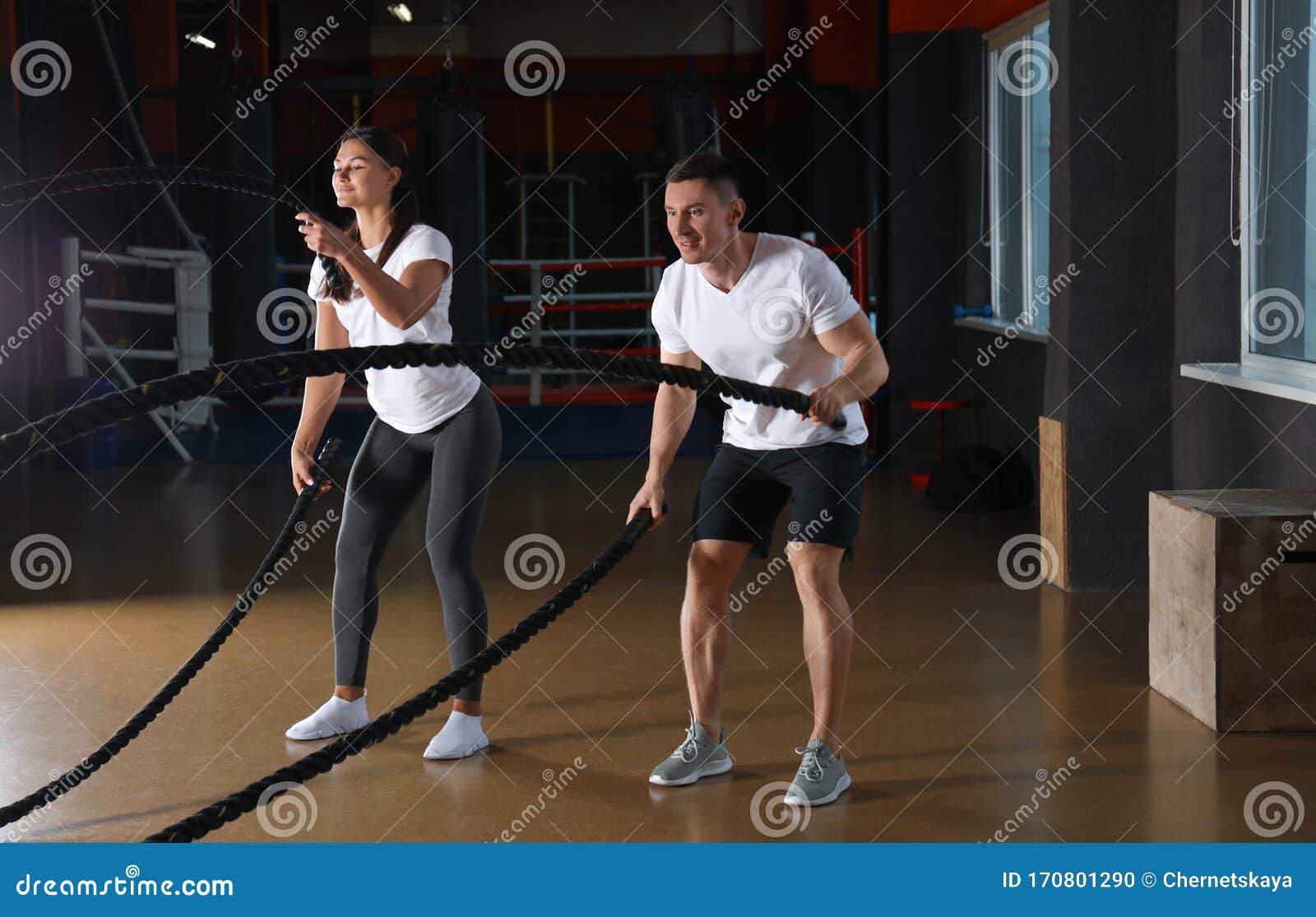 Couple Working Out with Battle Ropes Stock Photo - Image of power ...