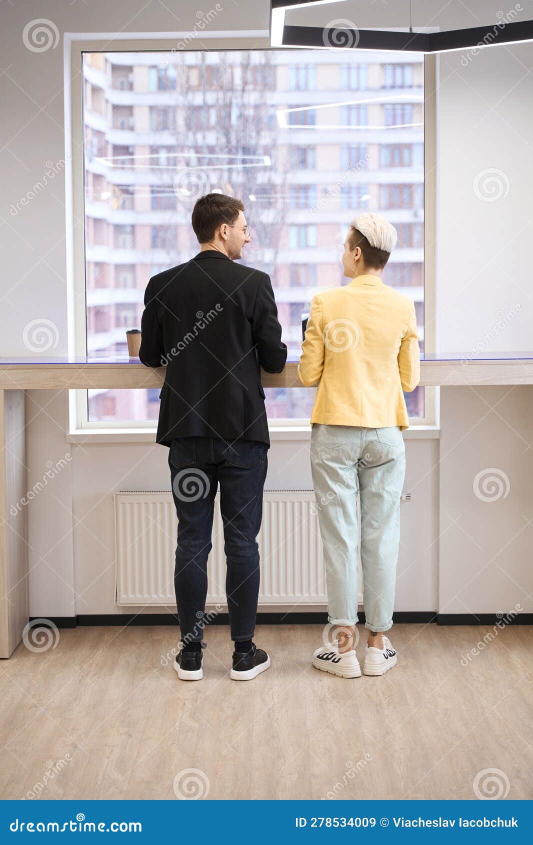 Couple Working on Project at Workplace Near Window Stock Image - Image ...