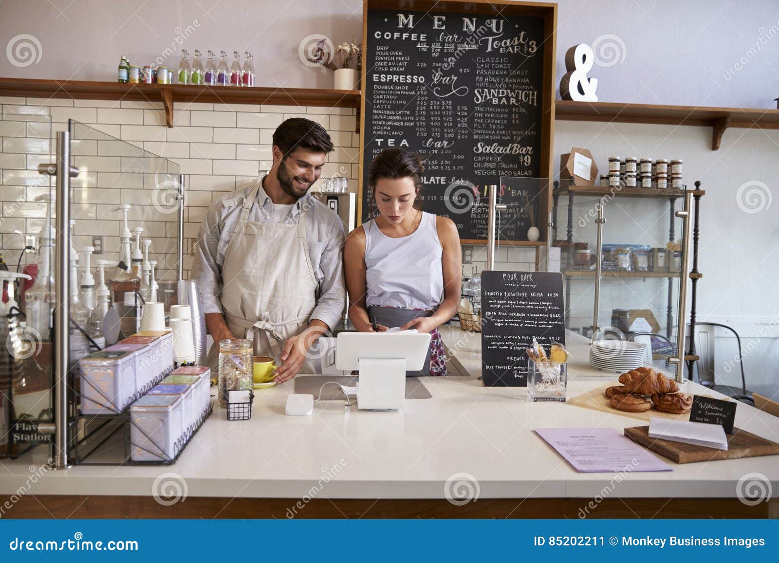 Couple Working Together at the Till in a Coffee Shop Stock Image ...