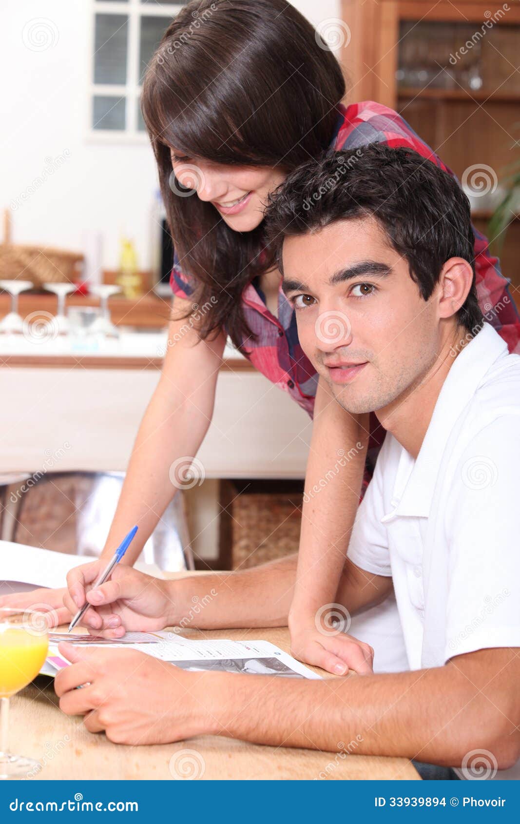 Couple writing on atable stock photo. Image of paper - 33939894
