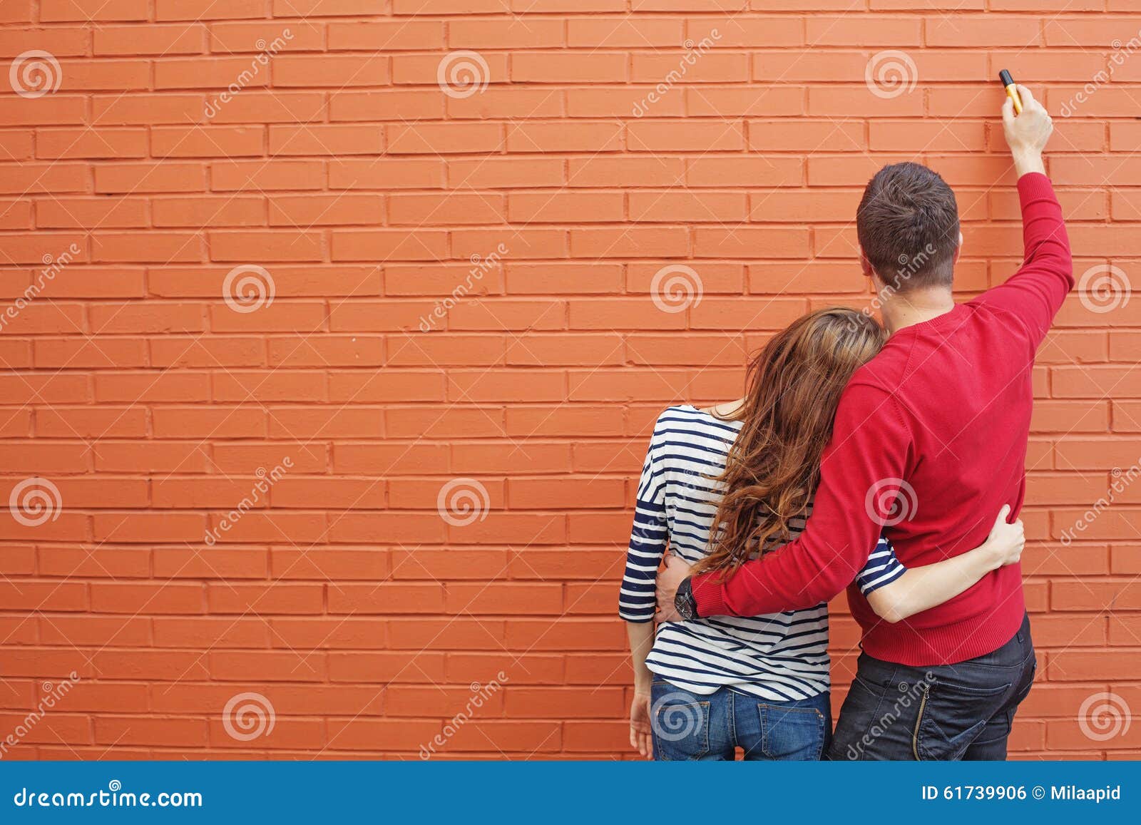 Couple Writing Something on a Blank Wall Stock Photo - Image of ...