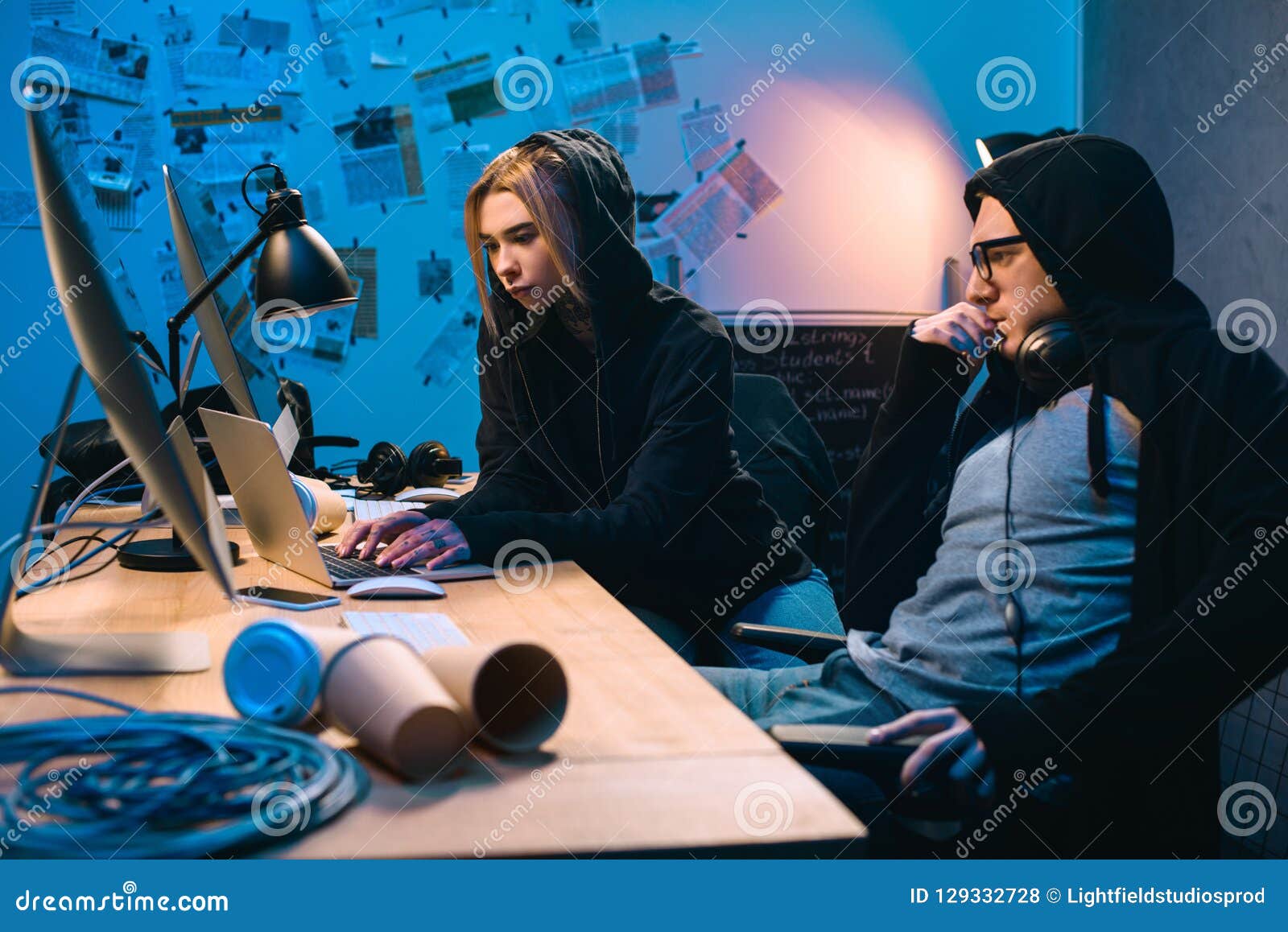 Couple of Young Hackers Using Laptop at Workplace Stock Photo - Image ... Couple of Young Hackers Using Laptop at Workplace Stock Photo - Image ...
