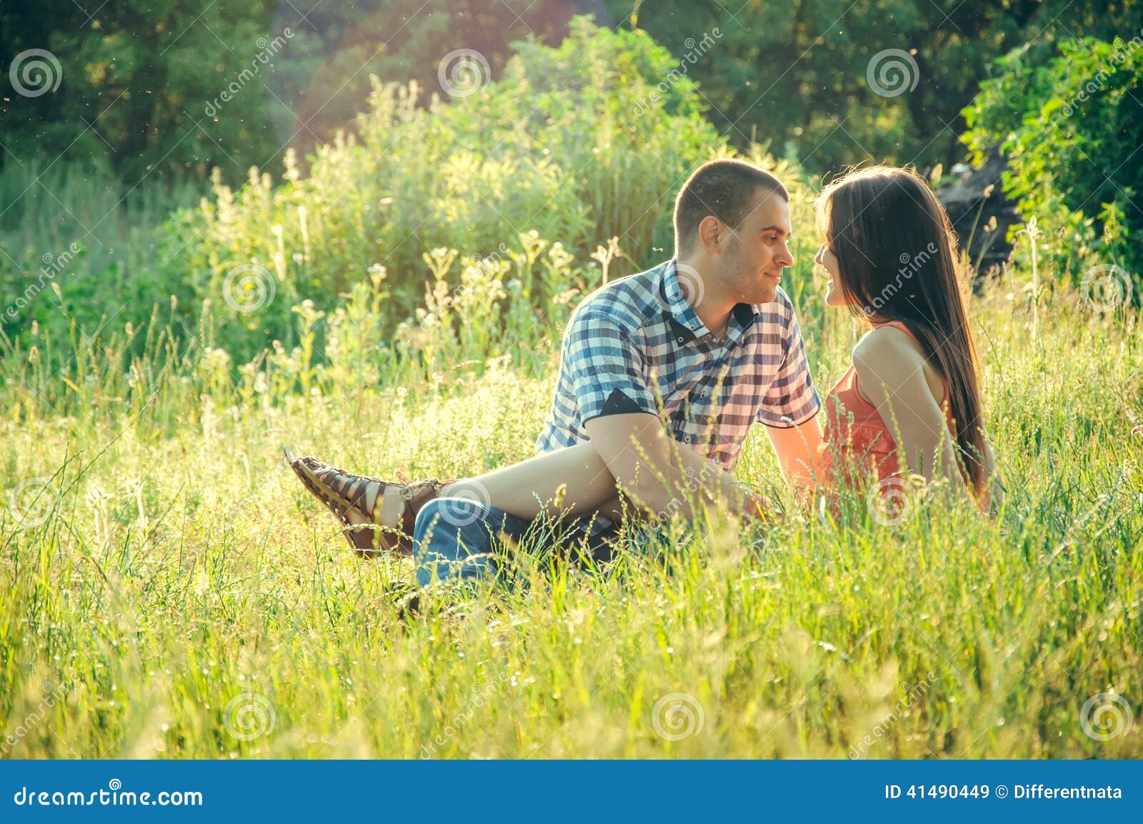 Couple Of Young Lovers Sitting On The Grass Stock Image Image Of