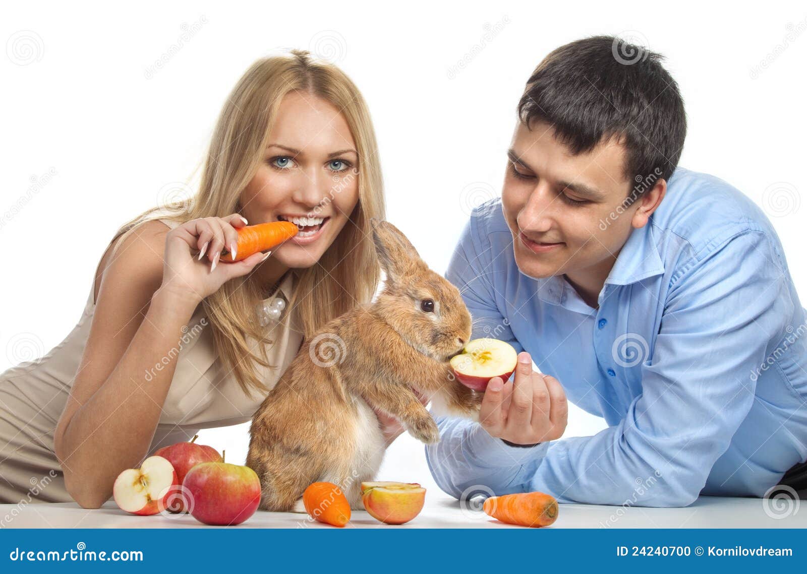 Couple with young rabbit stock photo. Image of funny - 24240700
