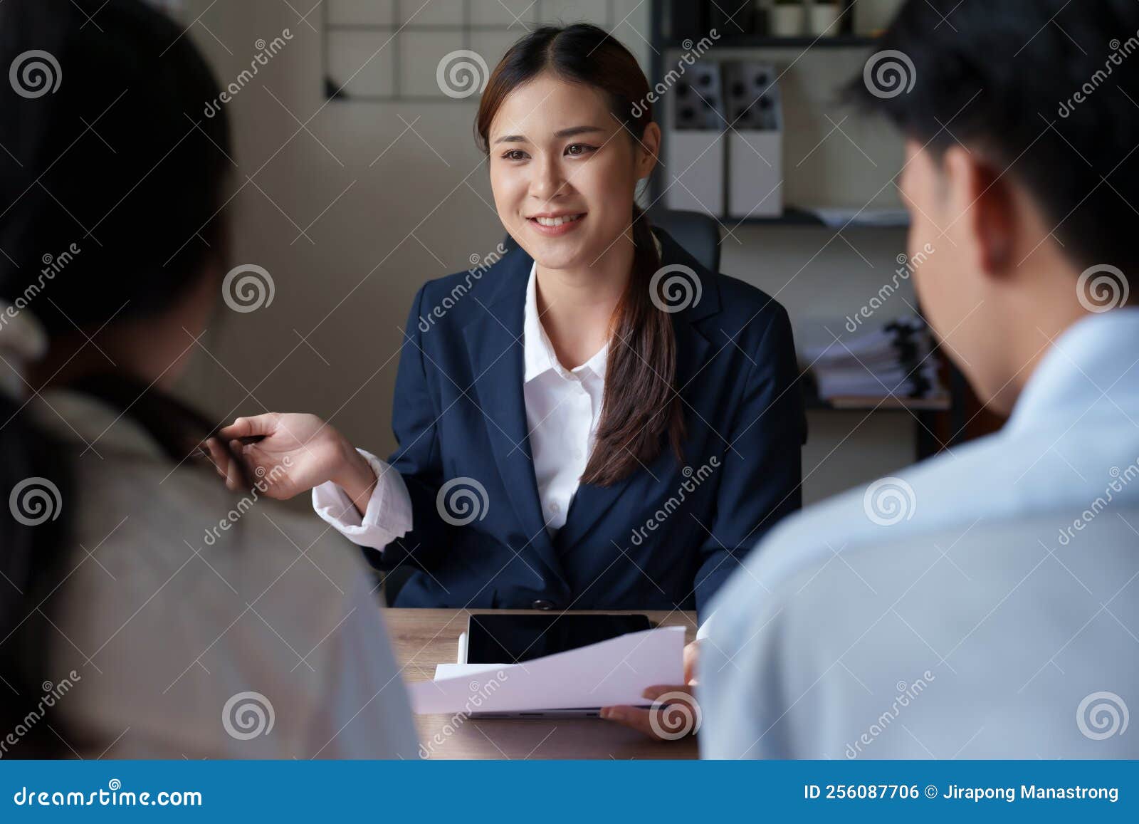 Couples Consult with a Representative To Plan an Insurance Contract ...