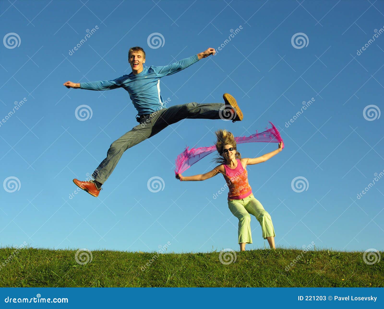 Couples jump on grass stock image. Image of physical, freedom - 221203