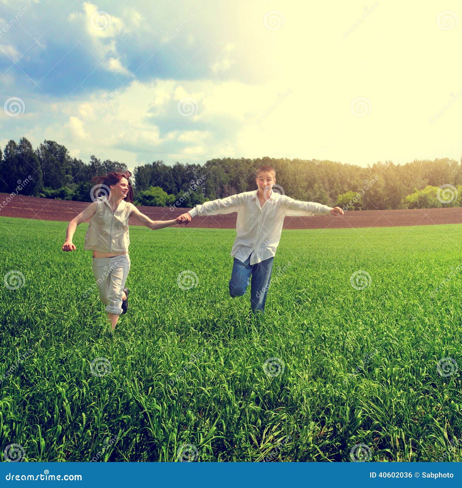 Couples Running at the Field Stock Photo - Image of male, motion: 40602036