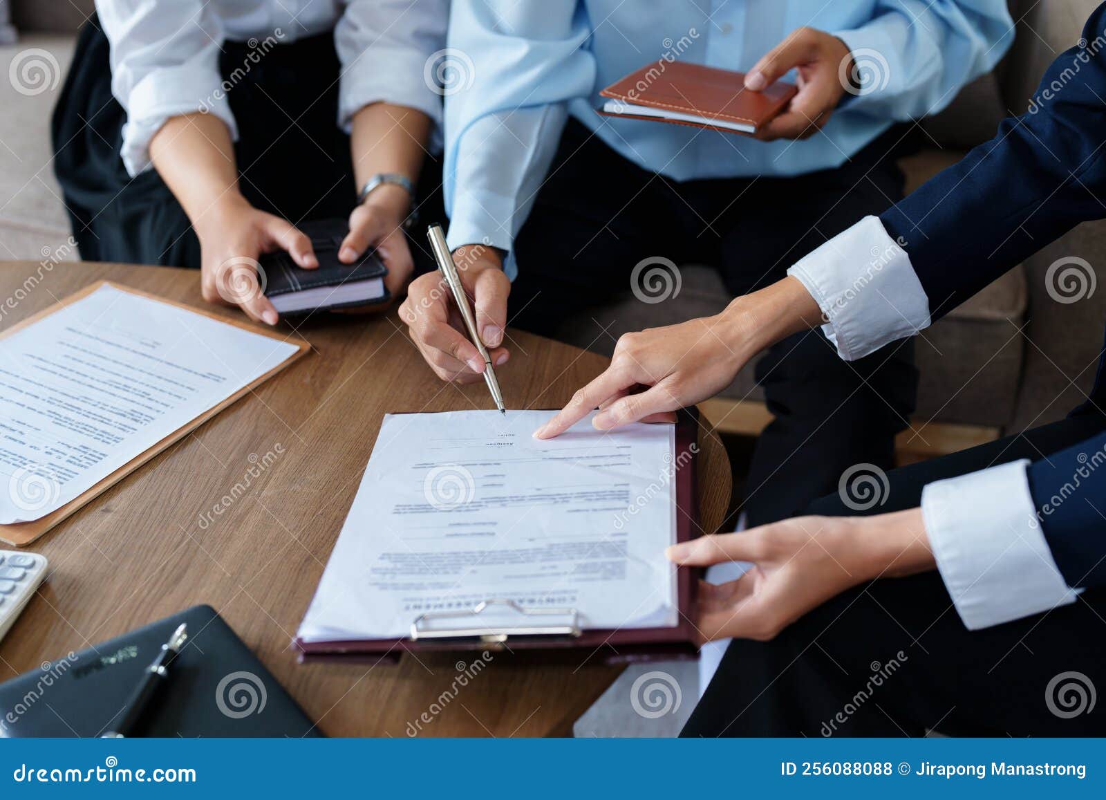 Couples Sign Important Documents with Insurance Agents Stock Photo ...