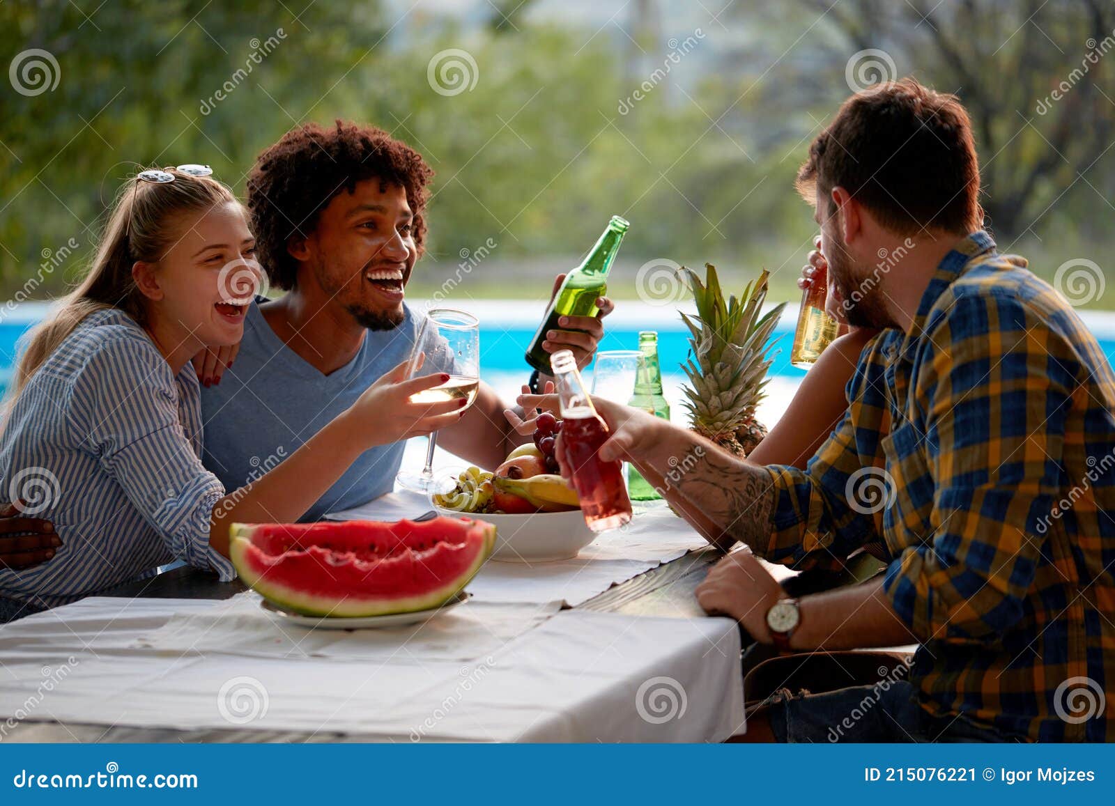 Couples Sitting at the Table by the Pool, Talking, Smiling, Laughing ...