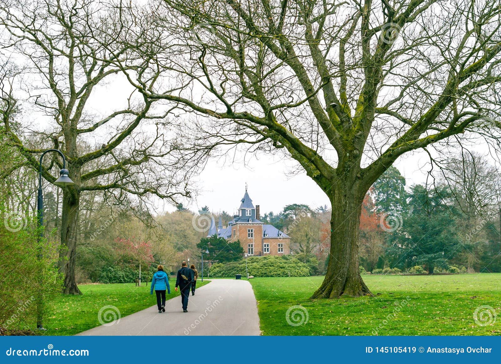 Couples Walking in a Park on a Cloudy Spring Day Stock Image - Image of ...
