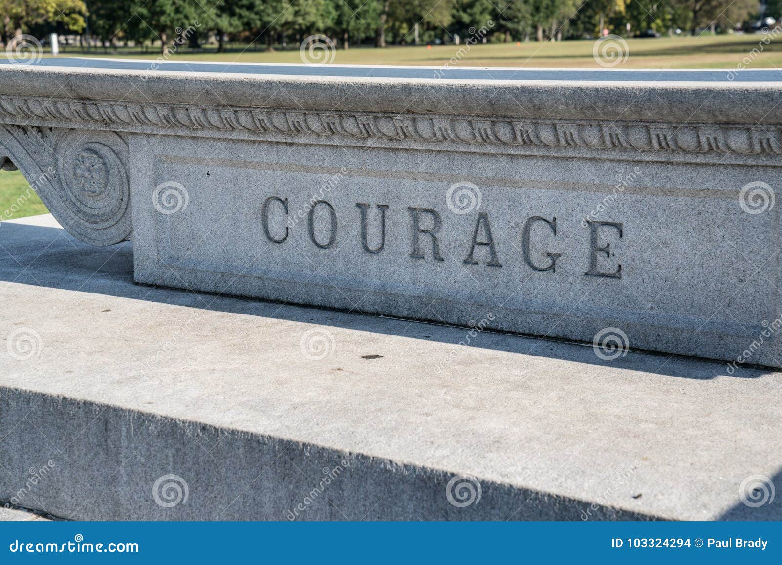Courage Sign Carved in Stone Stock Photo - Image of engraved ...