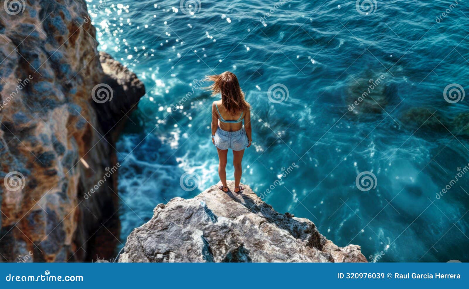 Courage Woman Standing High Above the Ocean on the Edge of a Cliff ...