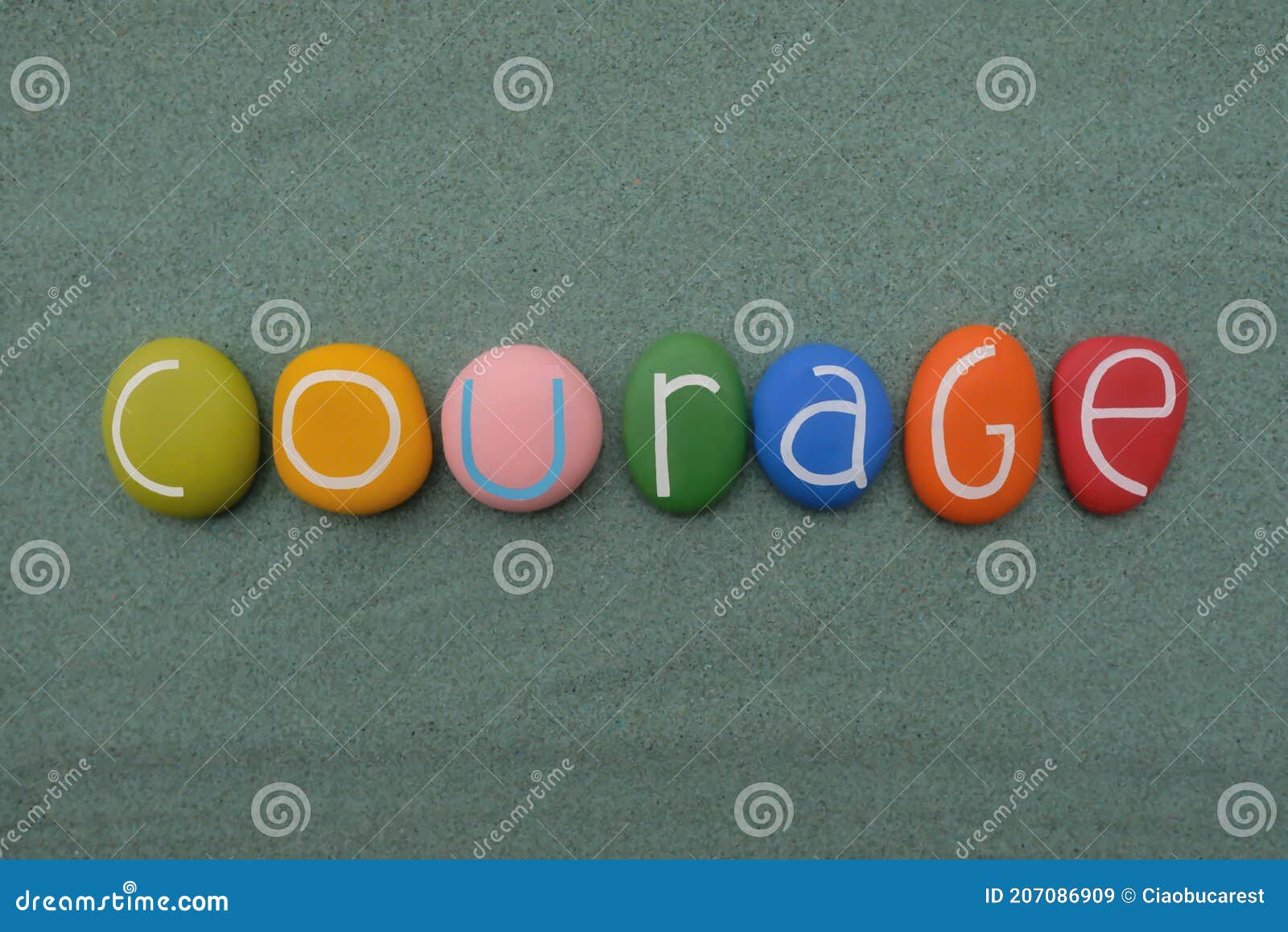 Courage Word Composed with Multi Colored Stone Letters Over Green Sand ...