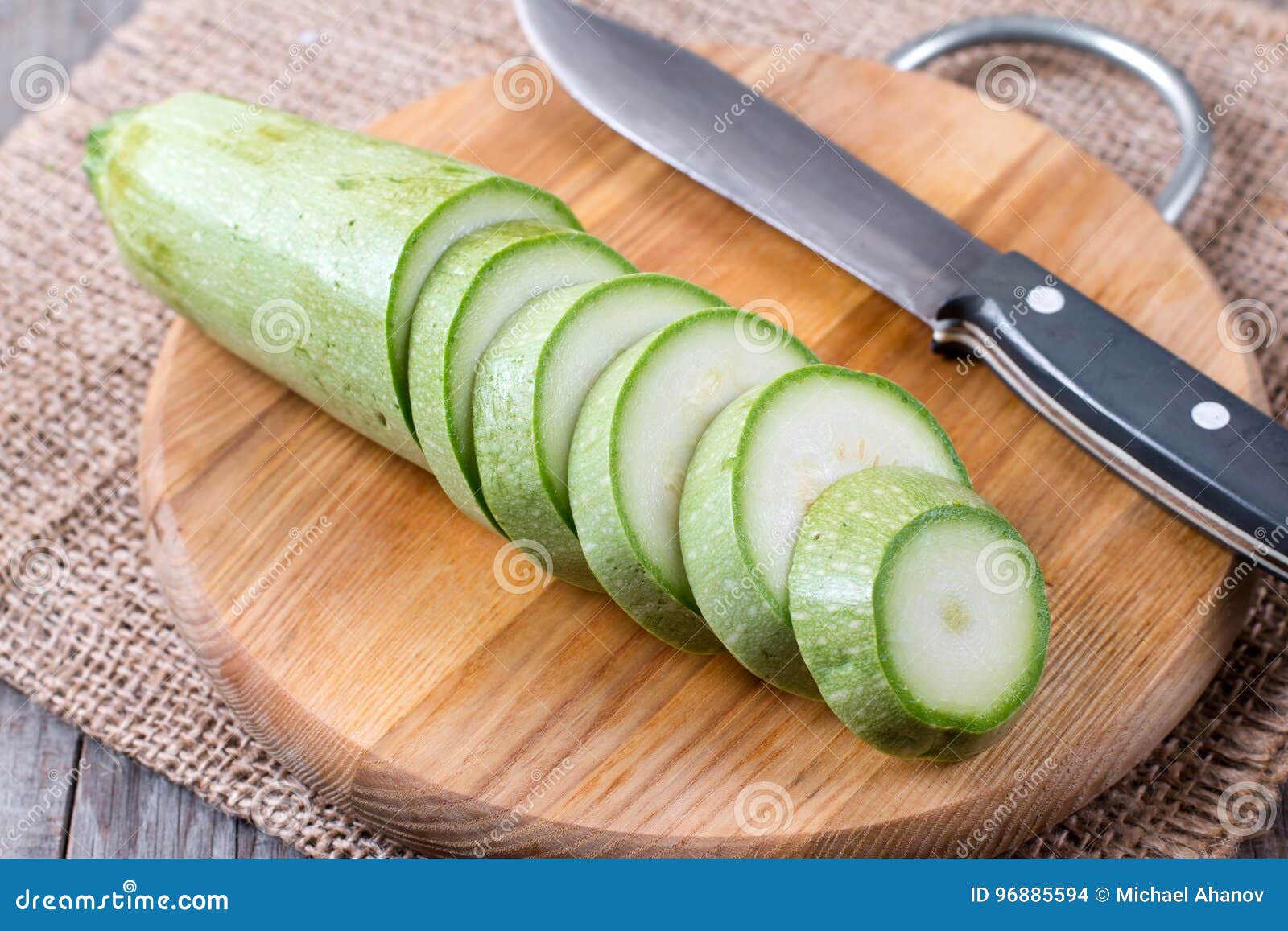 Courgette Cut on Slices on Cutting Board Stock Photo - Image of market ...