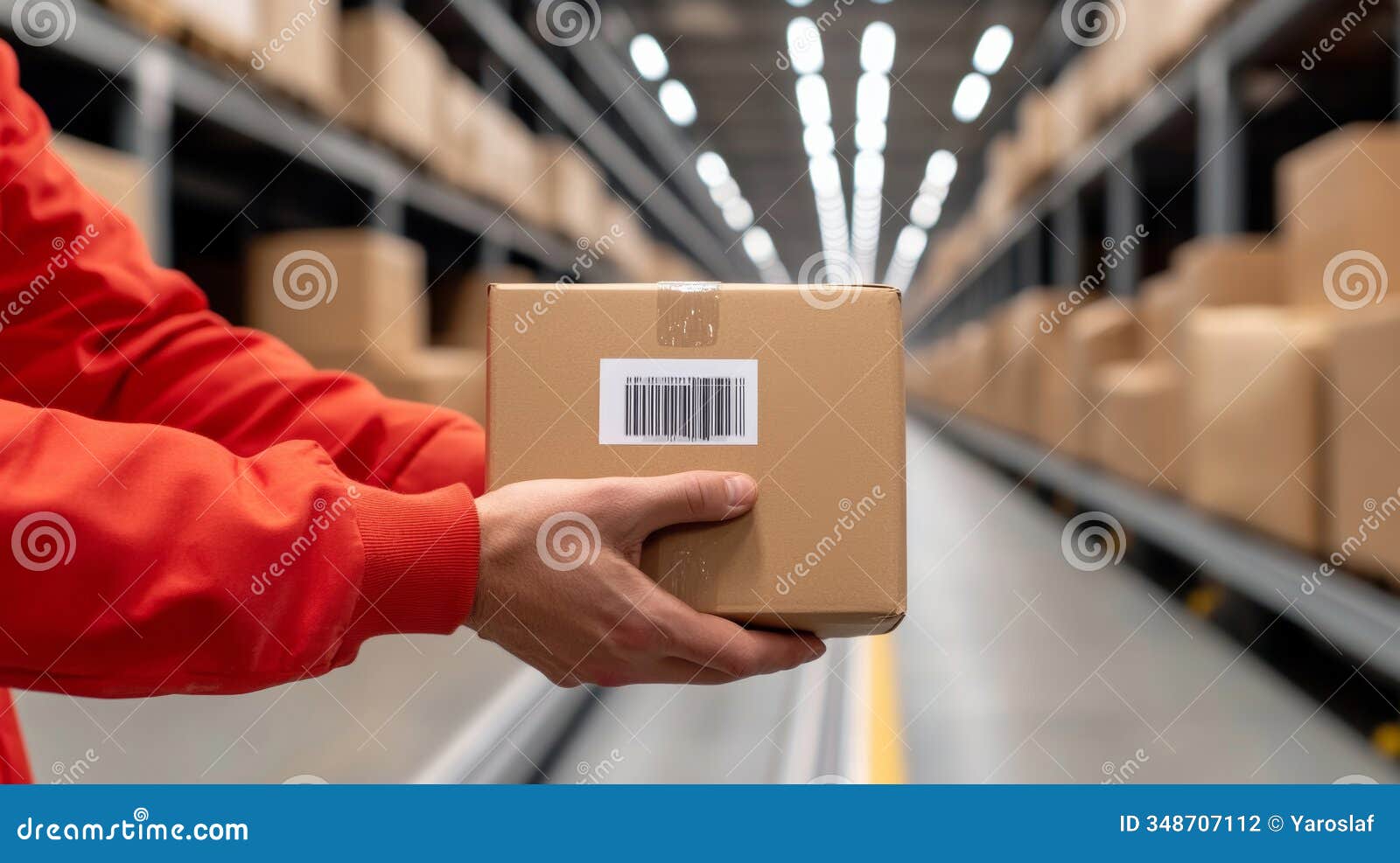 Courier with Barcode-labeled Cardboard Box in Warehouse, Representing ...