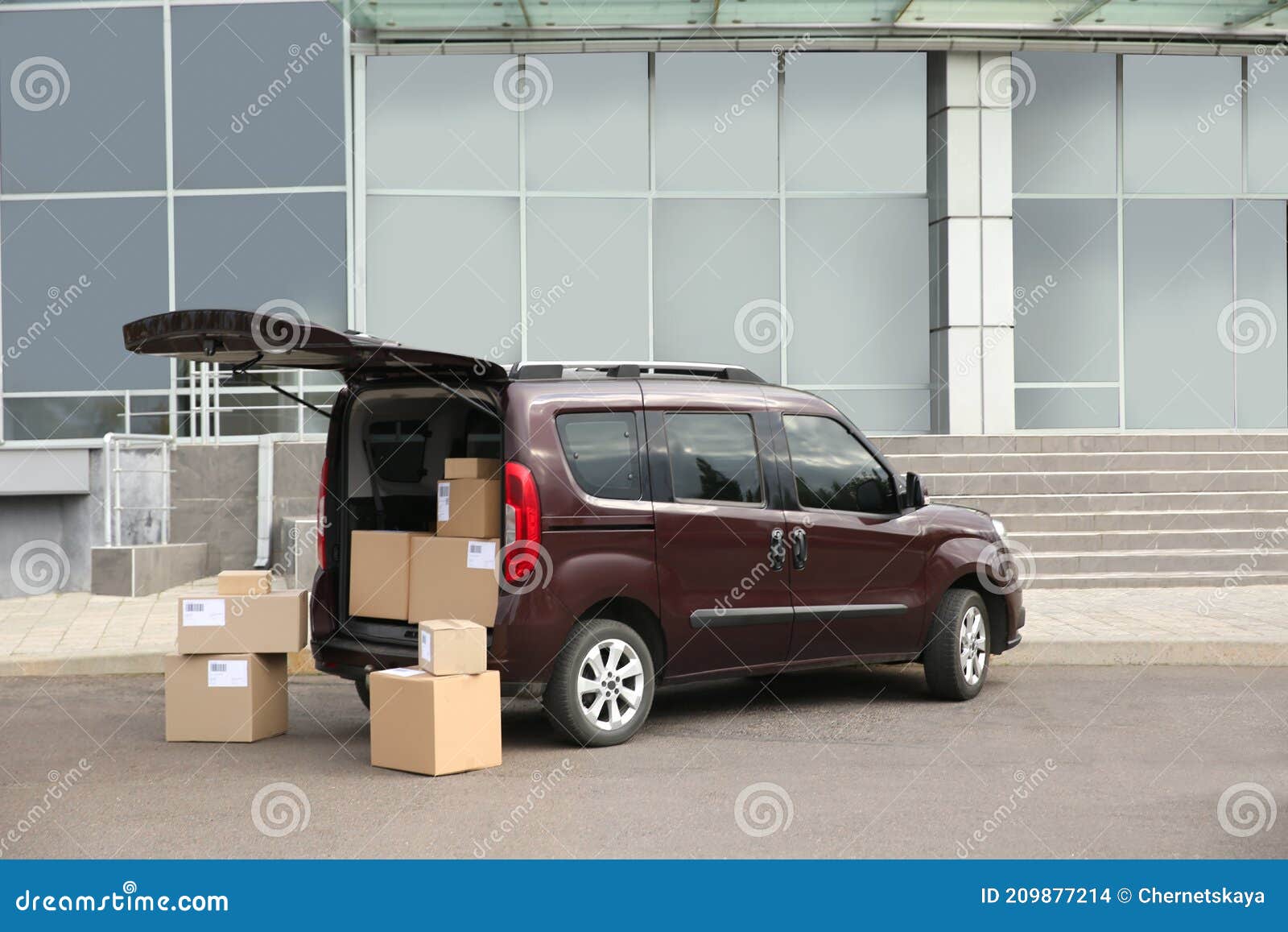 Courier Car with Packages Parked Near Office Building Stock Photo ...