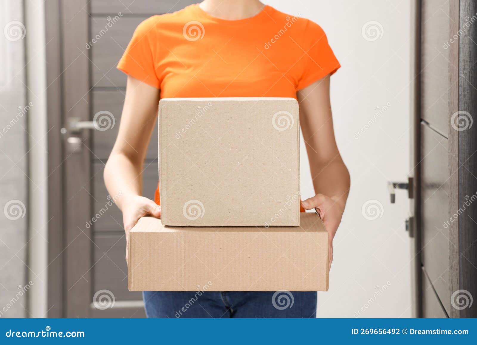 Courier with Cardboard Boxes in Hallway, Closeup Stock Photo - Image of ...
