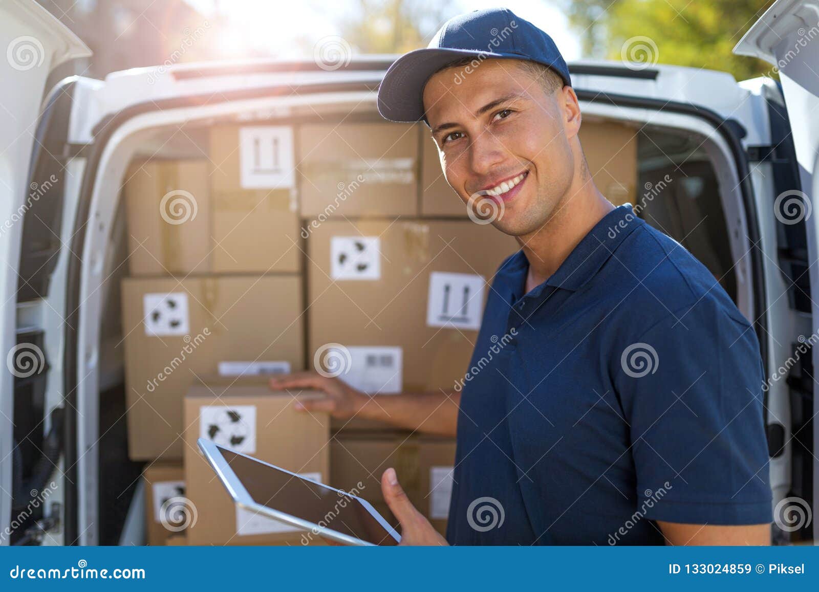 Courier Checking the Deliveries in His Van Stock Image - Image of ...