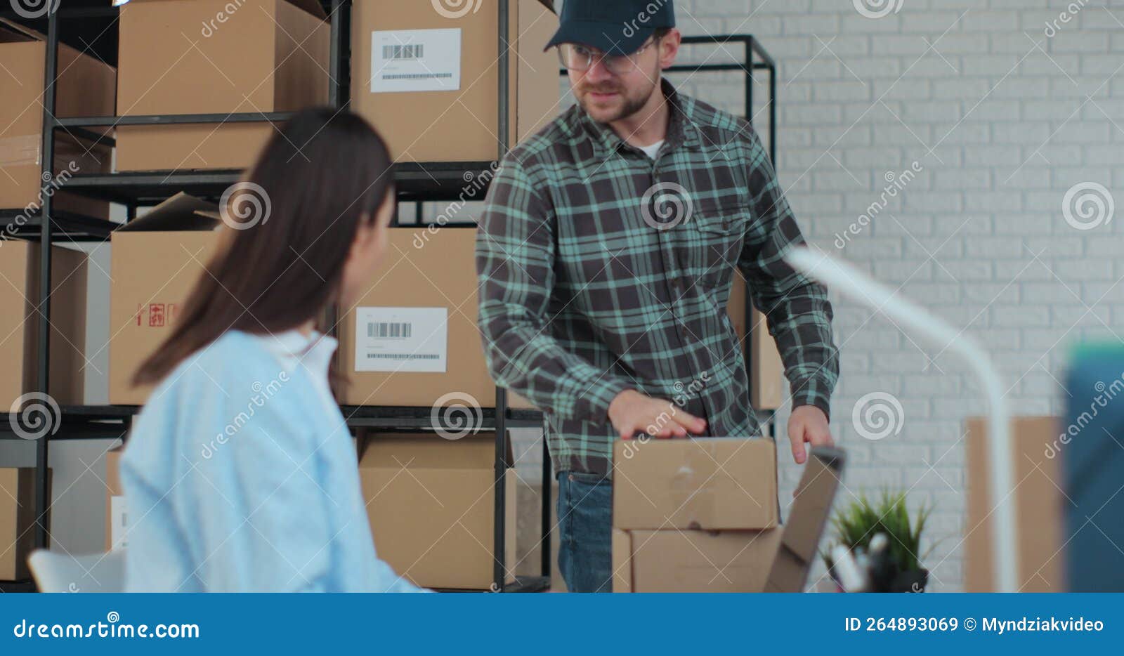 The Courier Comes To Pick Up the Package for the Customer. Female ...