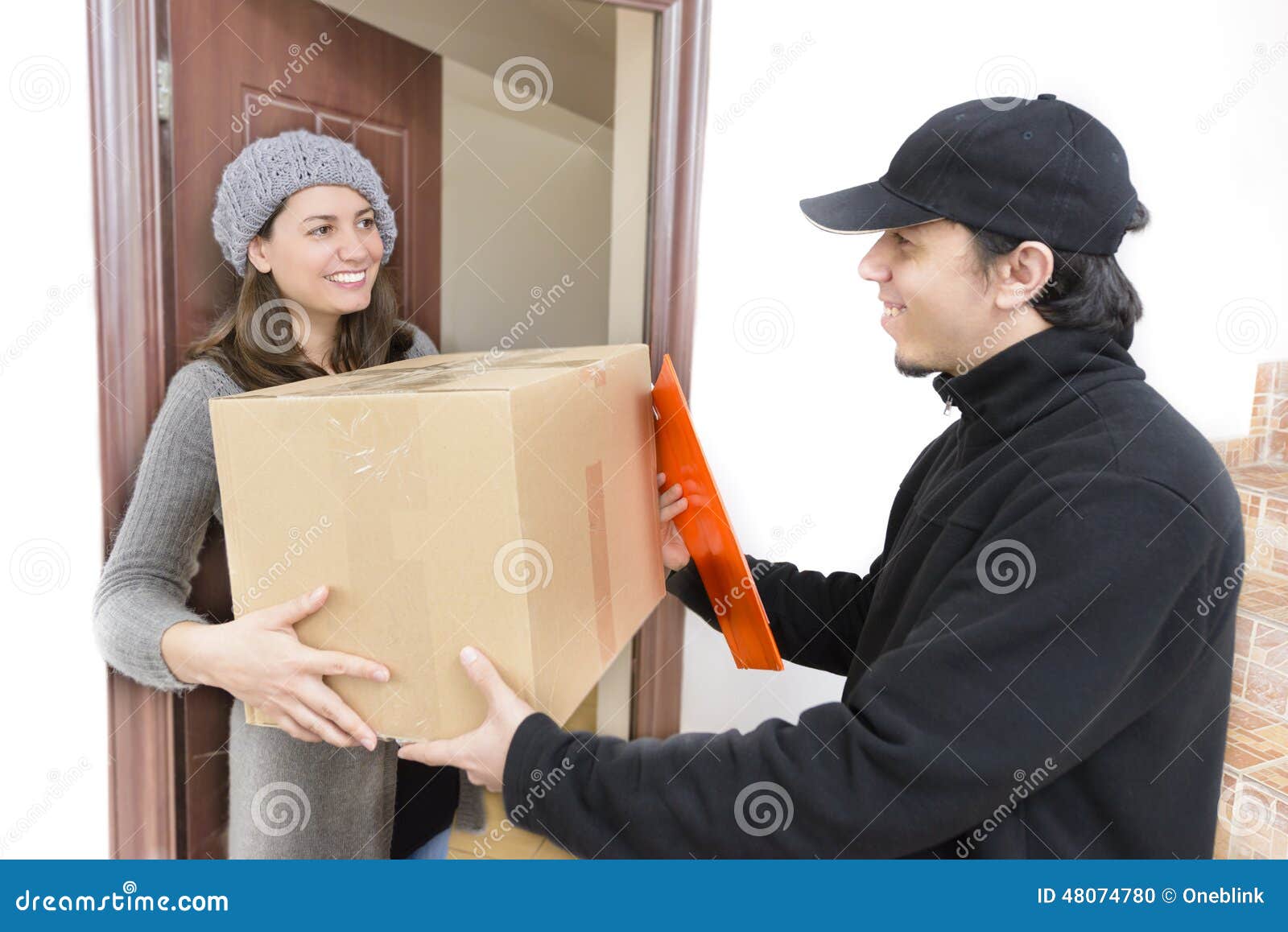 Courier Delivering a Package Stock Photo - Image of client, holding ...
