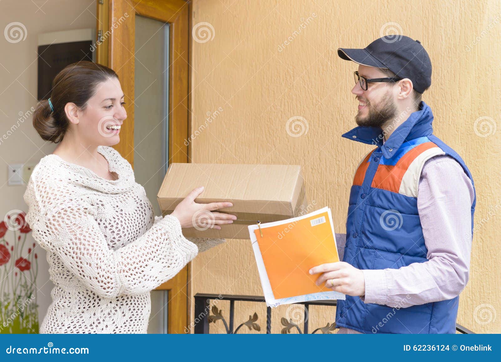 Courier Delivering a Package Stock Photo - Image of delivering, order ...