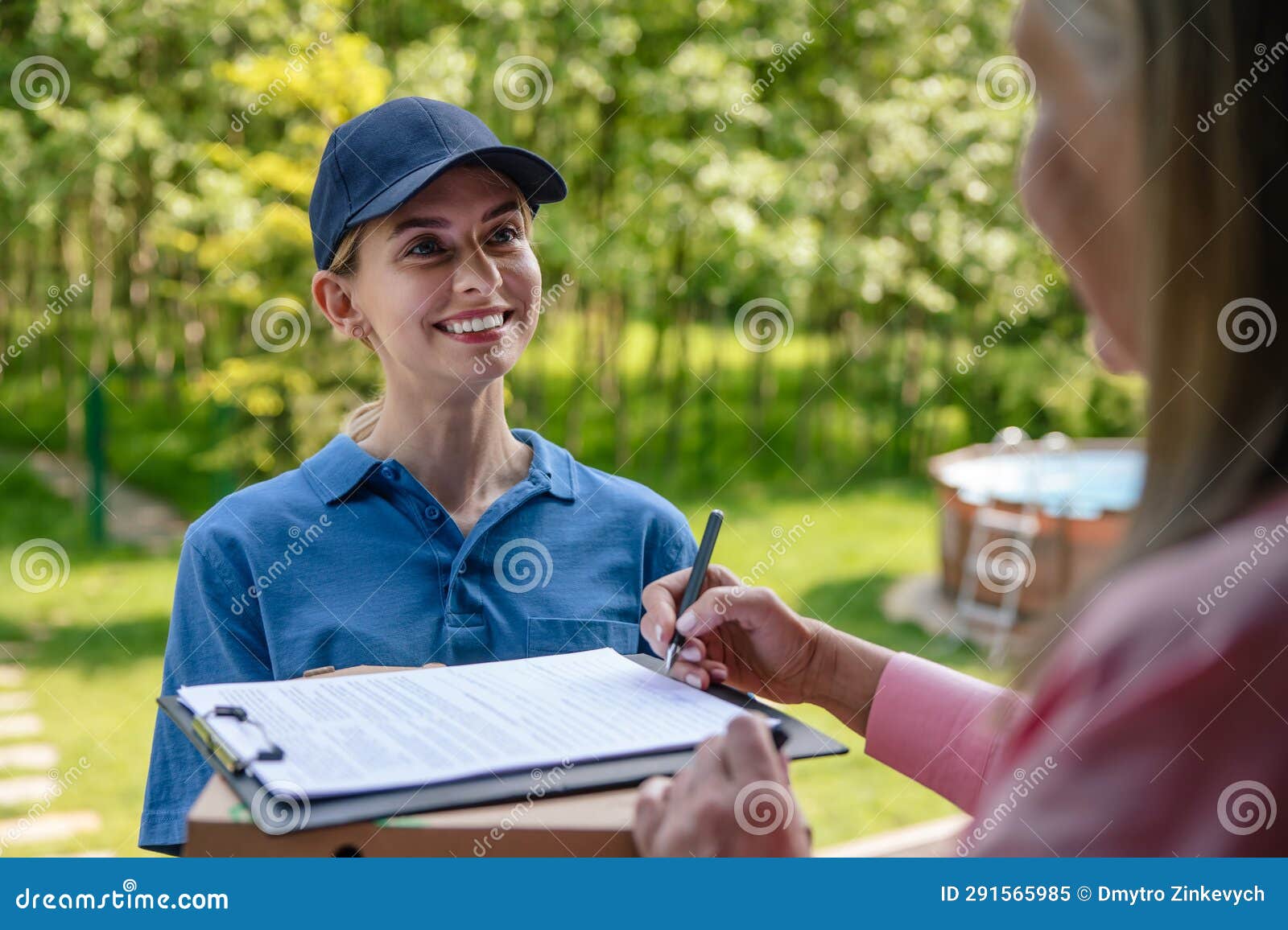 Courier Delivering Parcel, Customer Signs the Delivery Documents. Stock ...