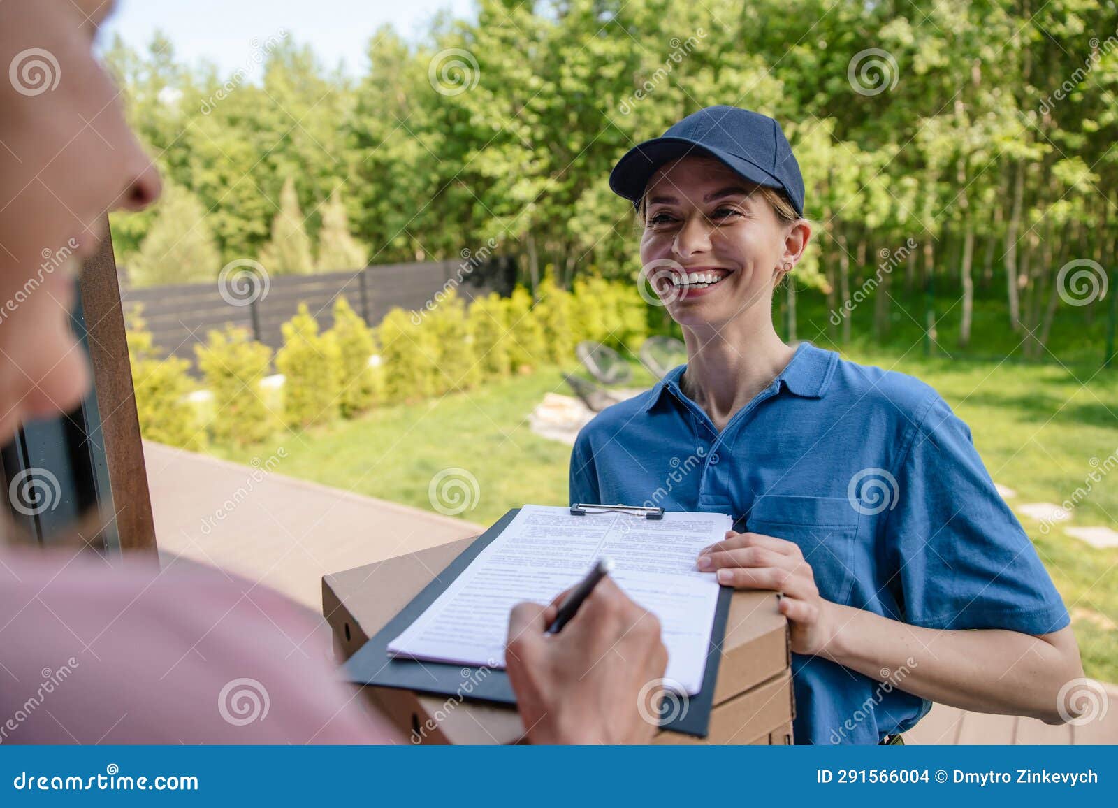 Courier Delivering Parcel, Customer Signs the Delivery Documents. Stock ...