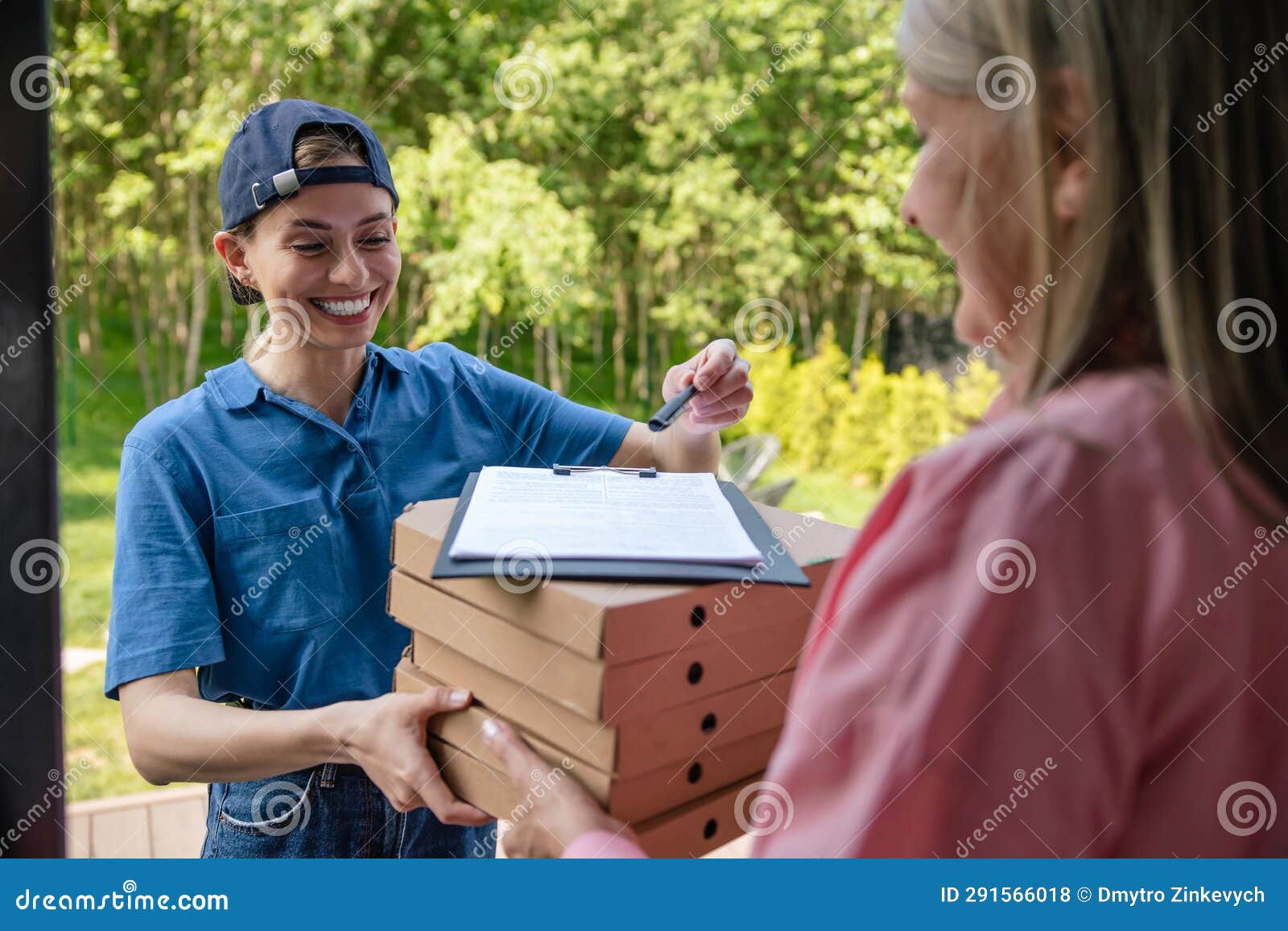 Courier Delivering Parcel, Customer Signs the Delivery Documents. Stock ...