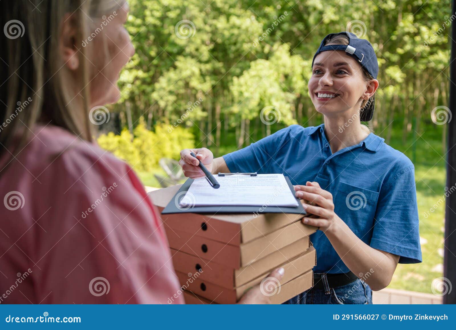Courier Delivering Parcel, Customer Signs the Delivery Documents. Stock ...