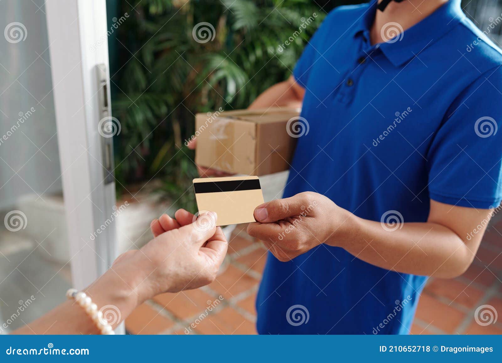 Courier delivering parcel stock photo. Image of working - 210652718