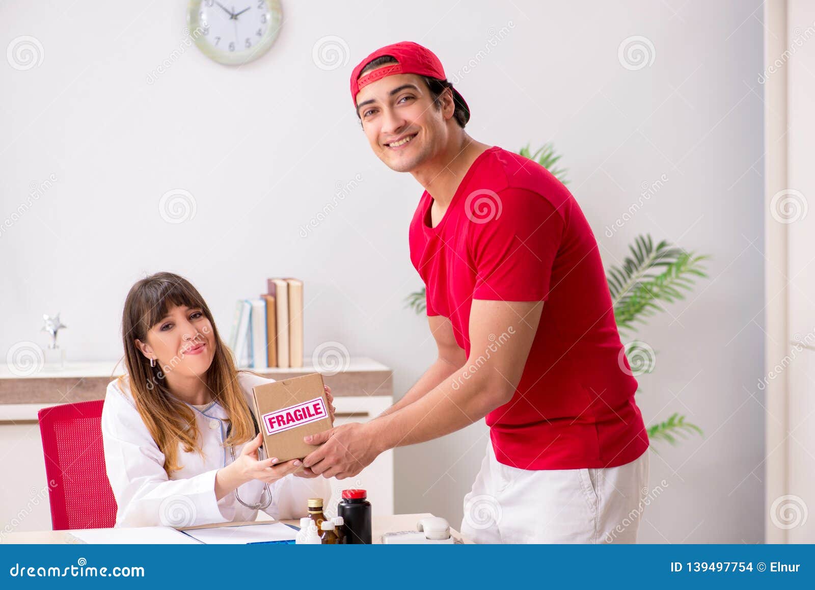 The Courier Delivering Urgent Parcel To the Hospital Stock Photo ...