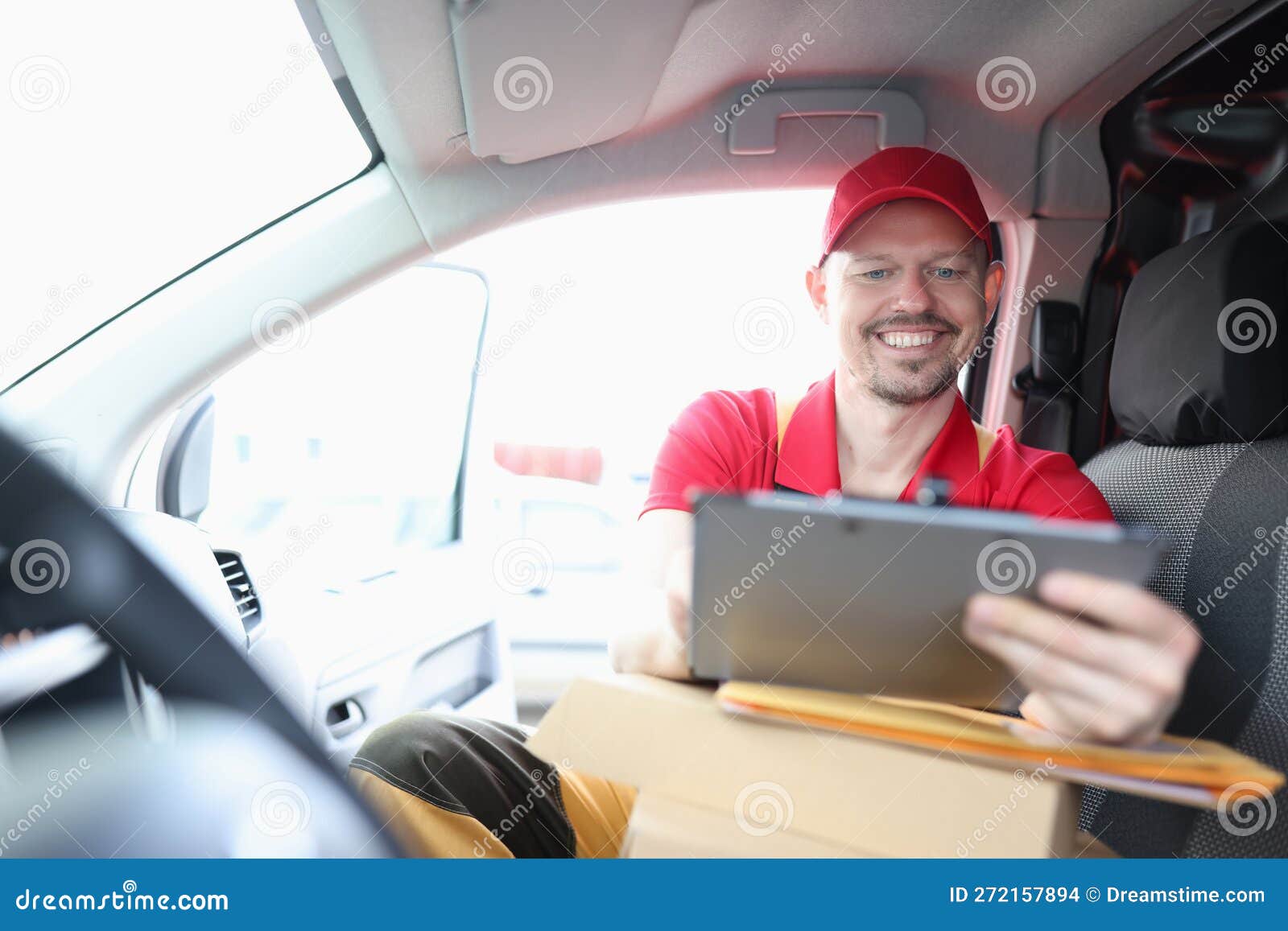 Courier is Engaged in Logistics of Delivery and Holds Tablet Stock ...